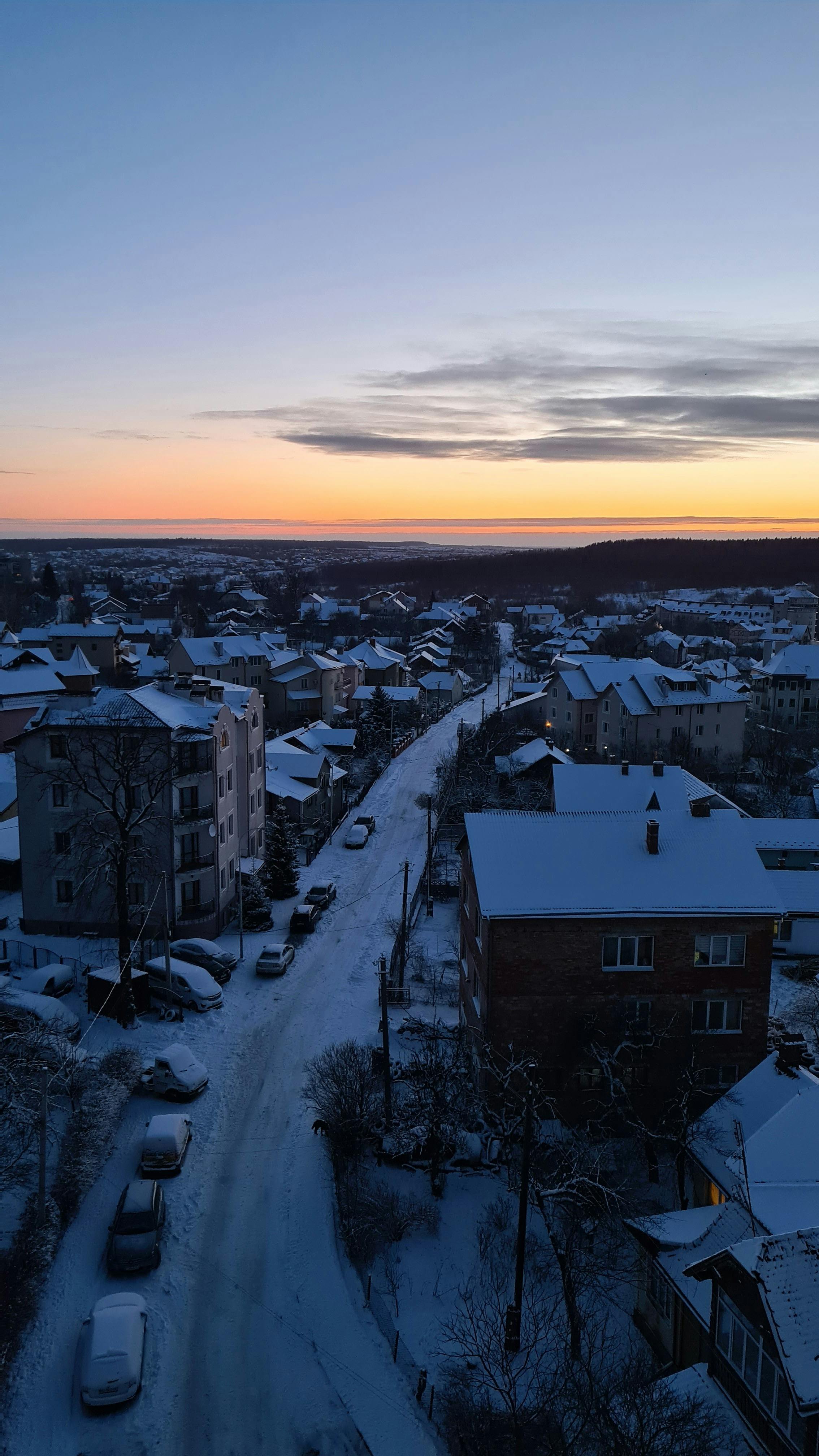 Snow in Town at Sunset · Free Stock Photo