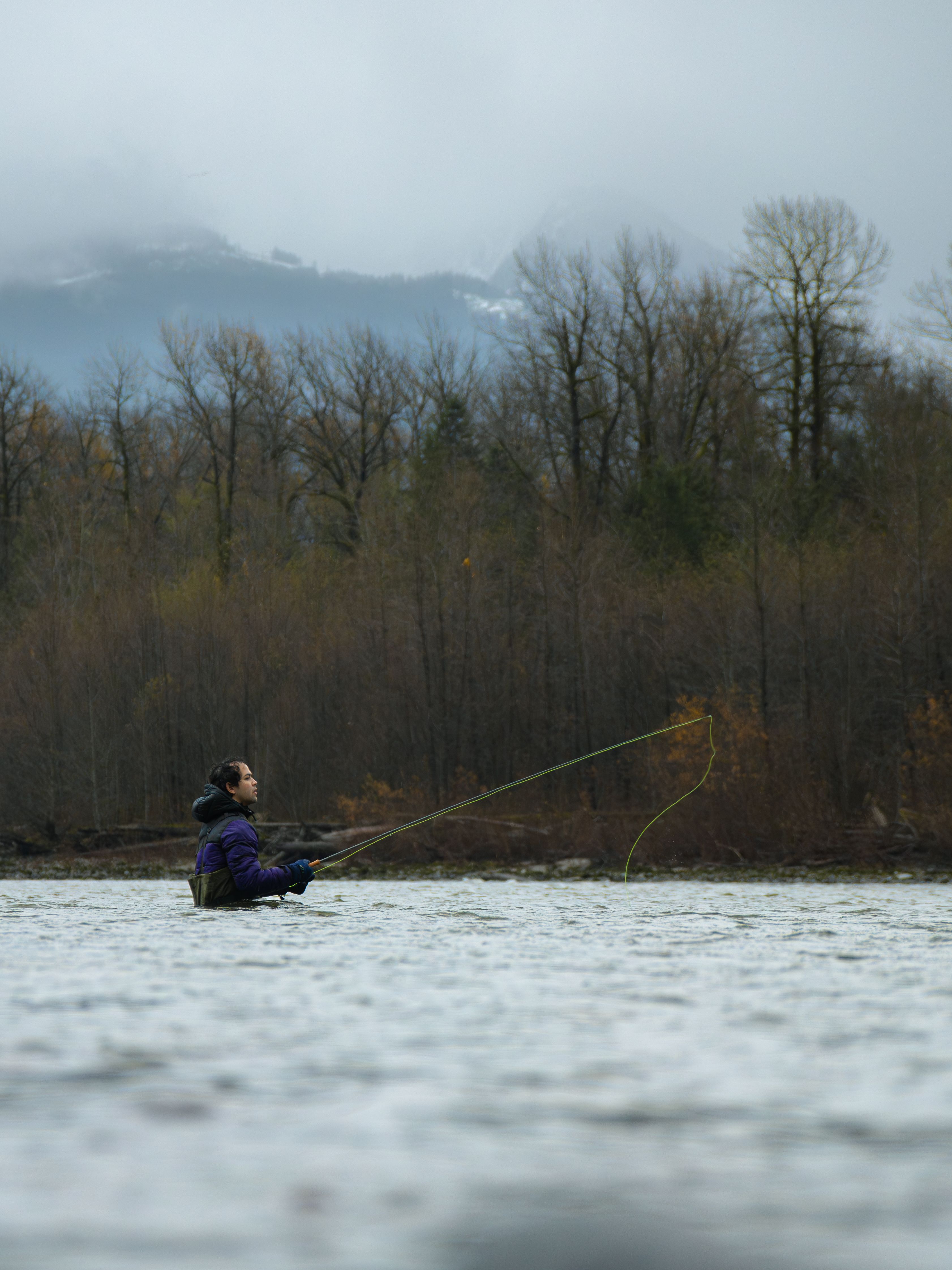 Candid Photo of a Man Standing in a Body of Water and Fishing · Free ...