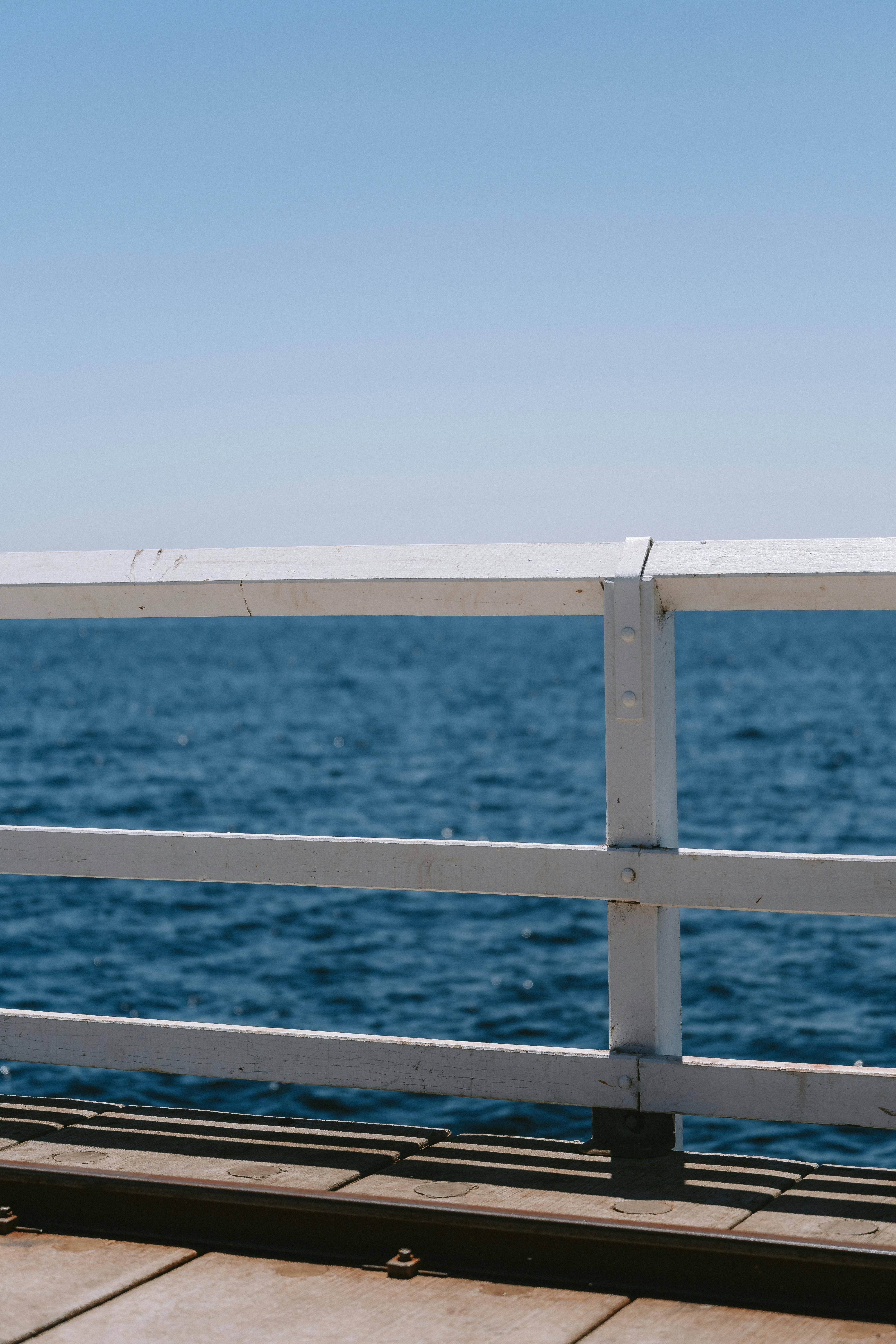 Railing on Pier on Sea Shore · Free Stock Photo