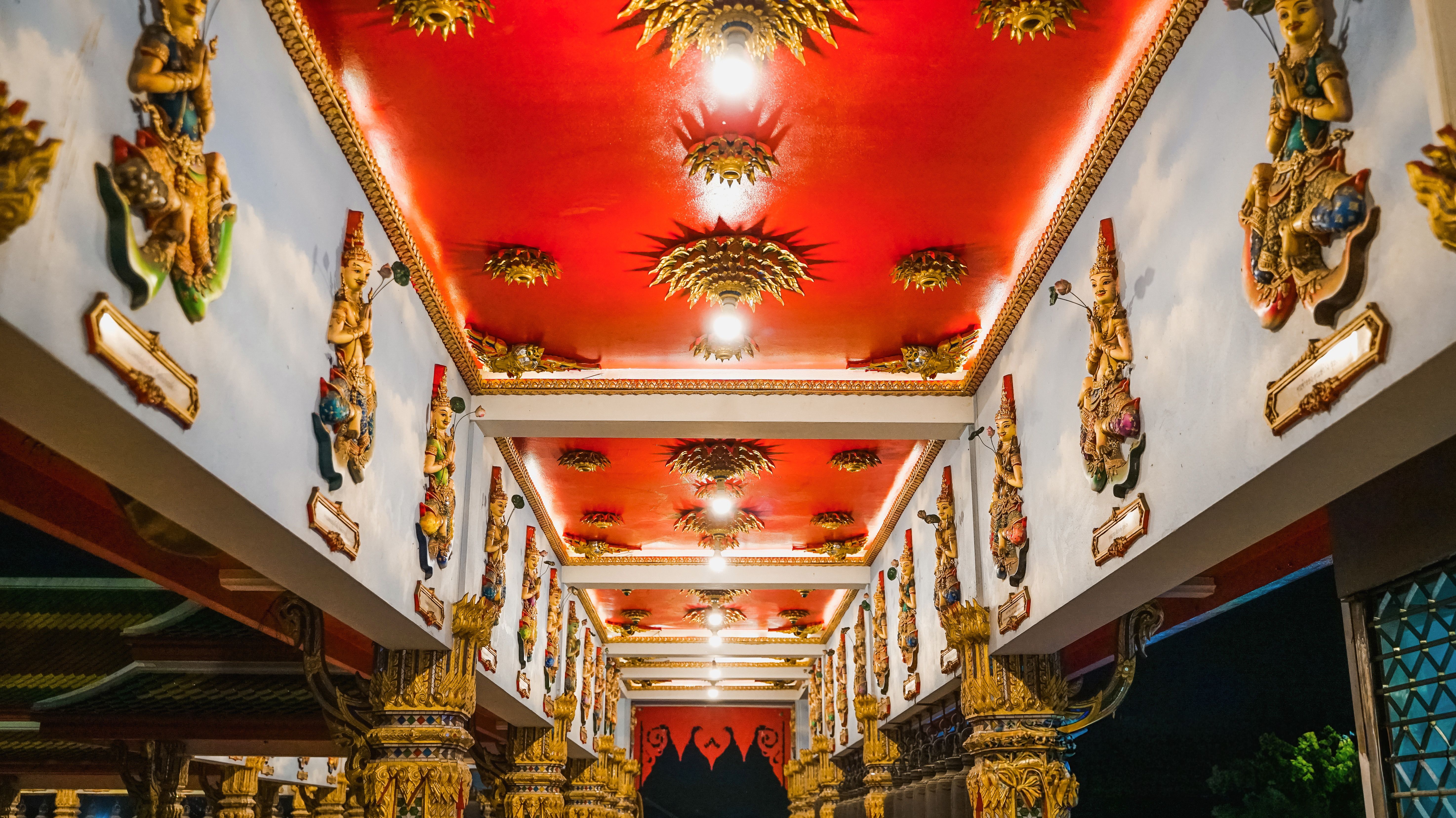 The ceiling of a temple with gold and red decorations · Free Stock Photo