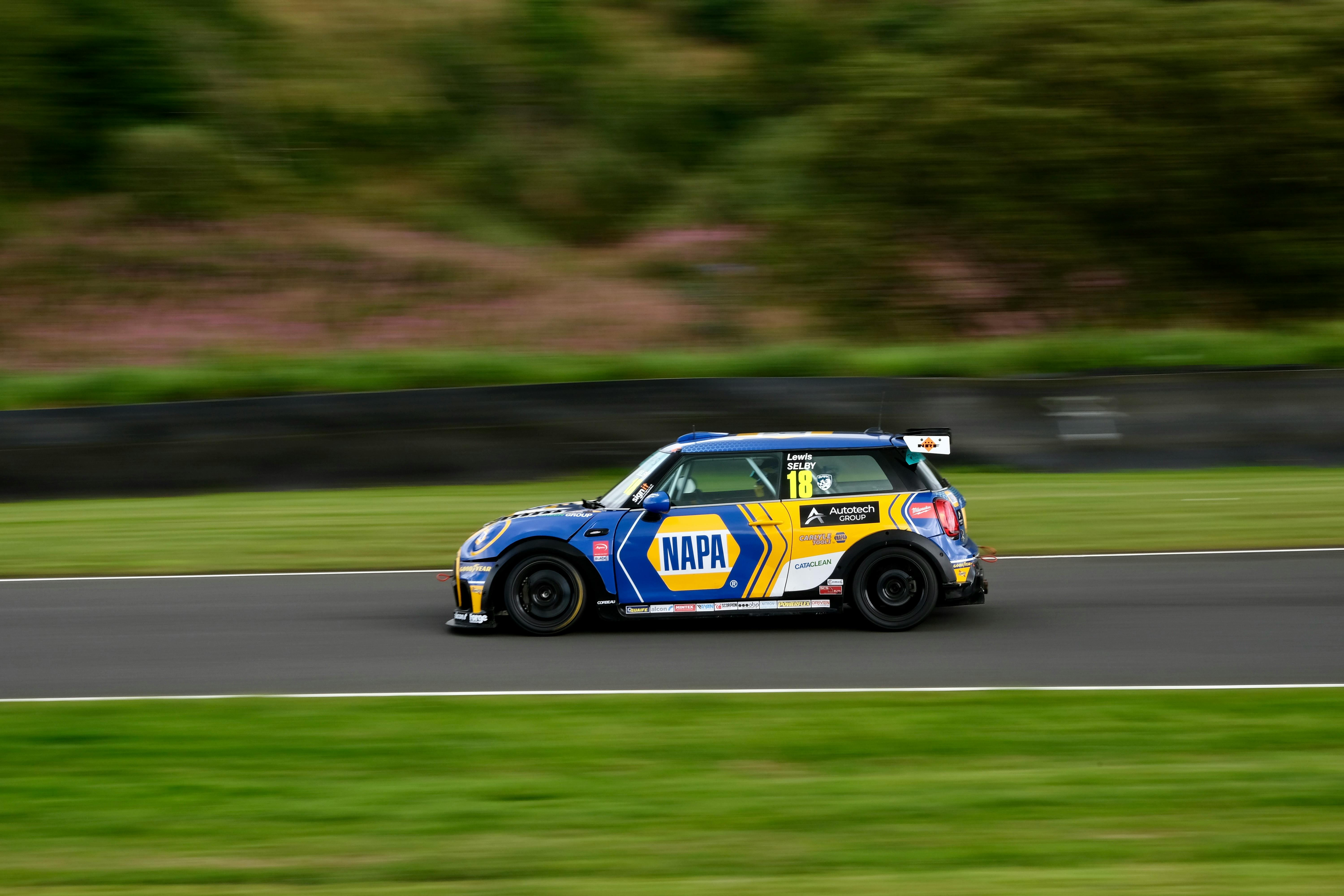 Racing Mini Cooper Speeding Around the Track · Free Stock Photo
