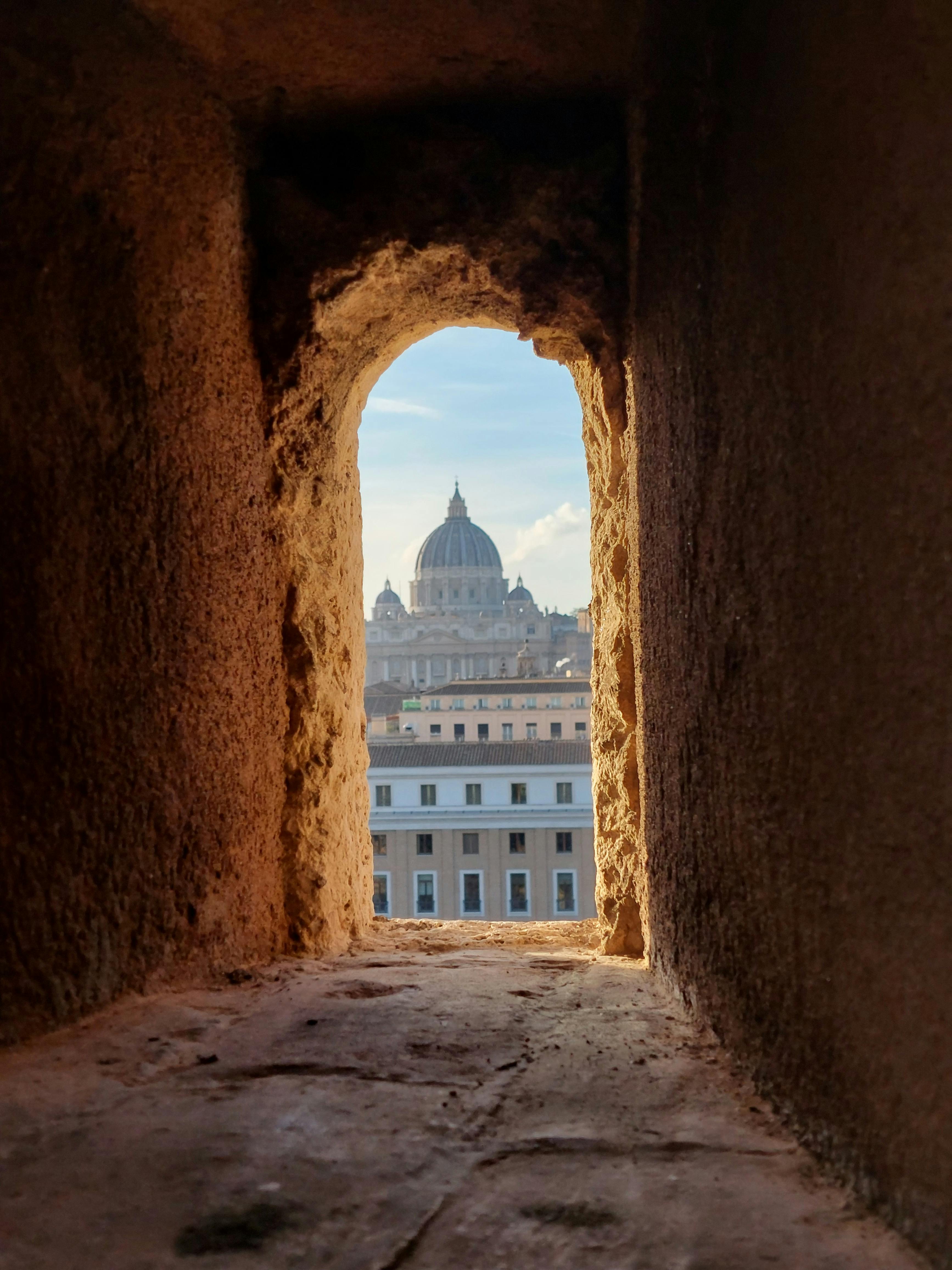 Dome of St. Peter Basilica trough Window in Walls · Free Stock Photo