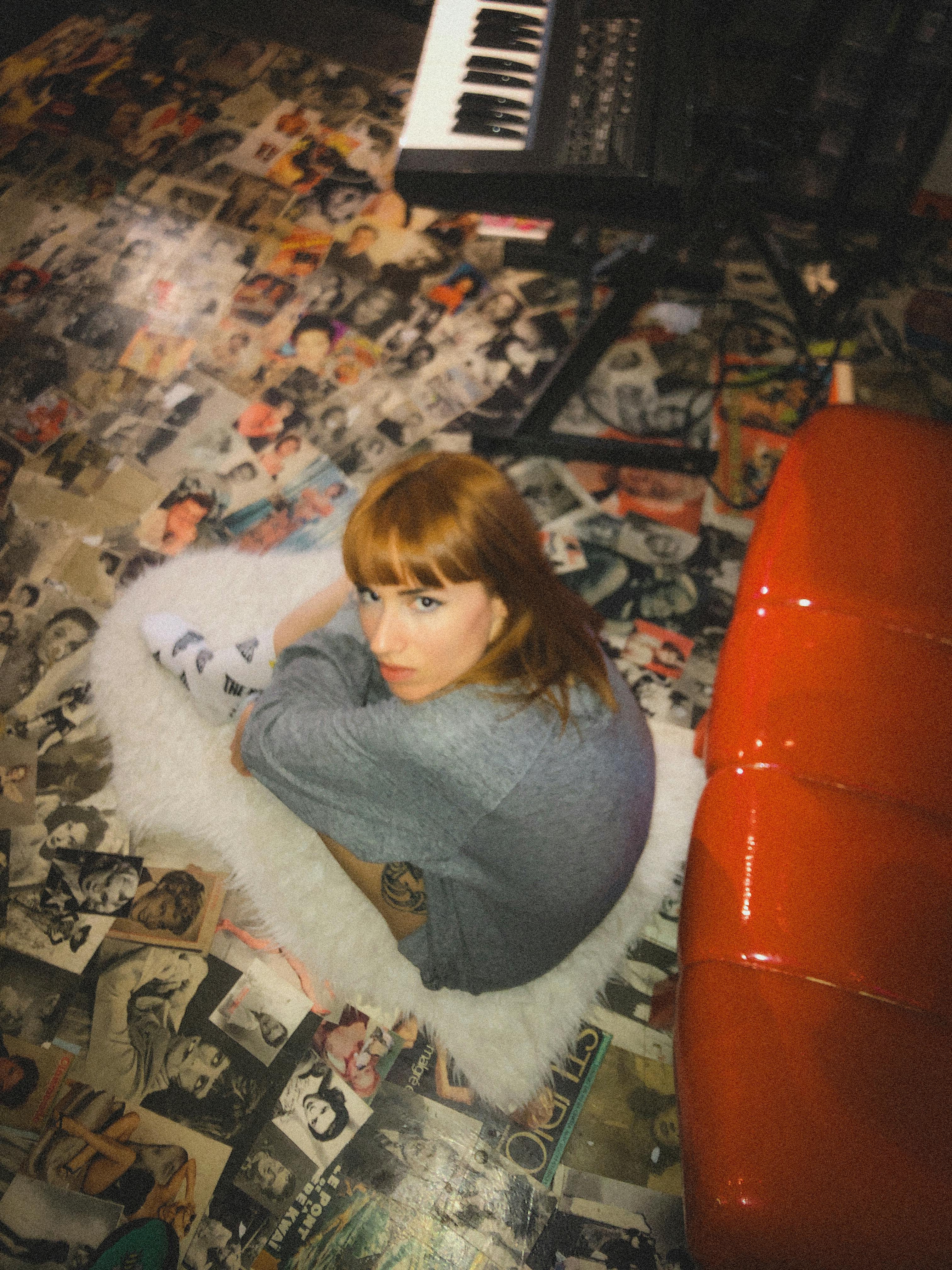 Sitting Woman on Rug is Looking Up · Free Stock Photo