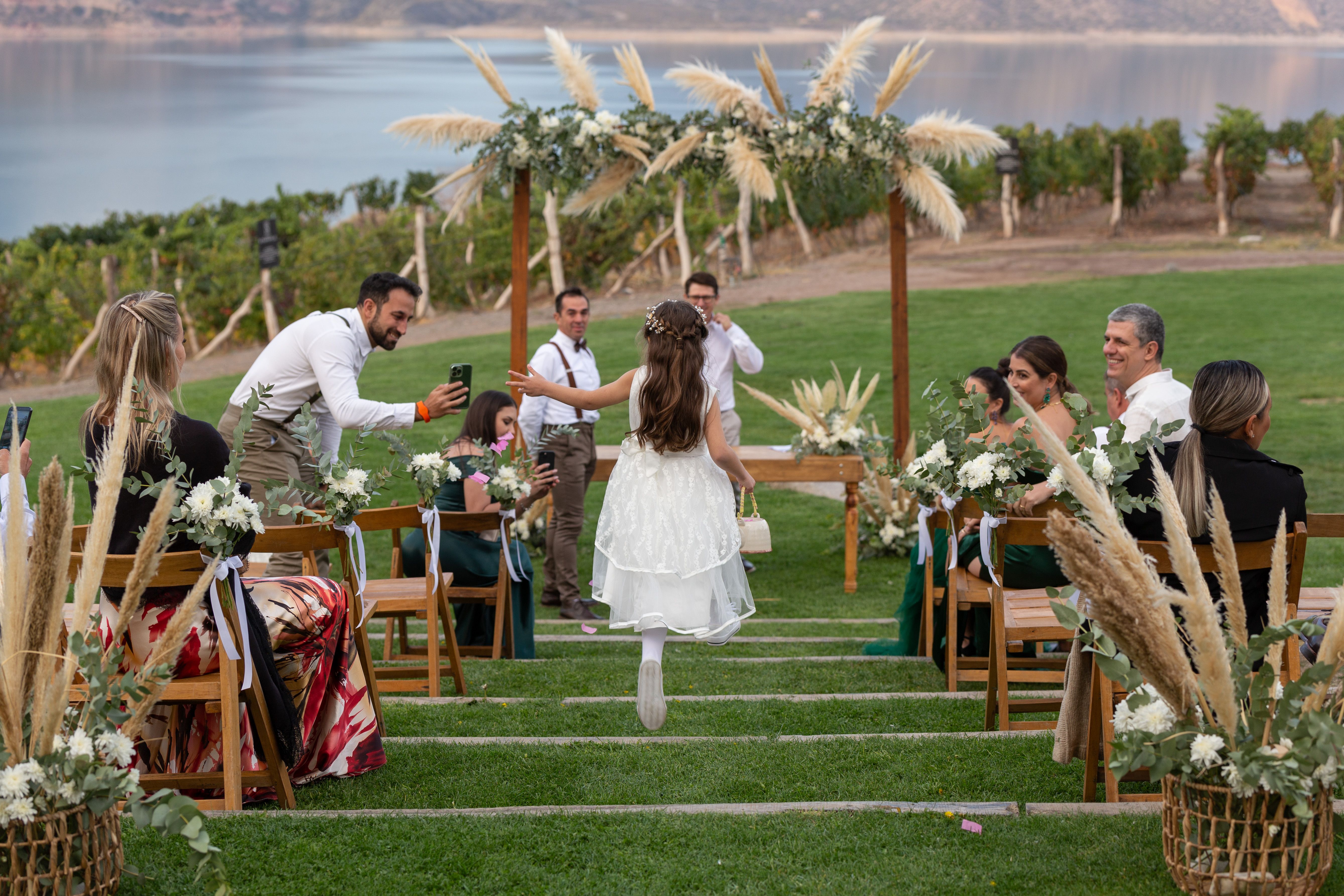 Back View of Child Jumping at Garden in Wedding · Free Stock Photo