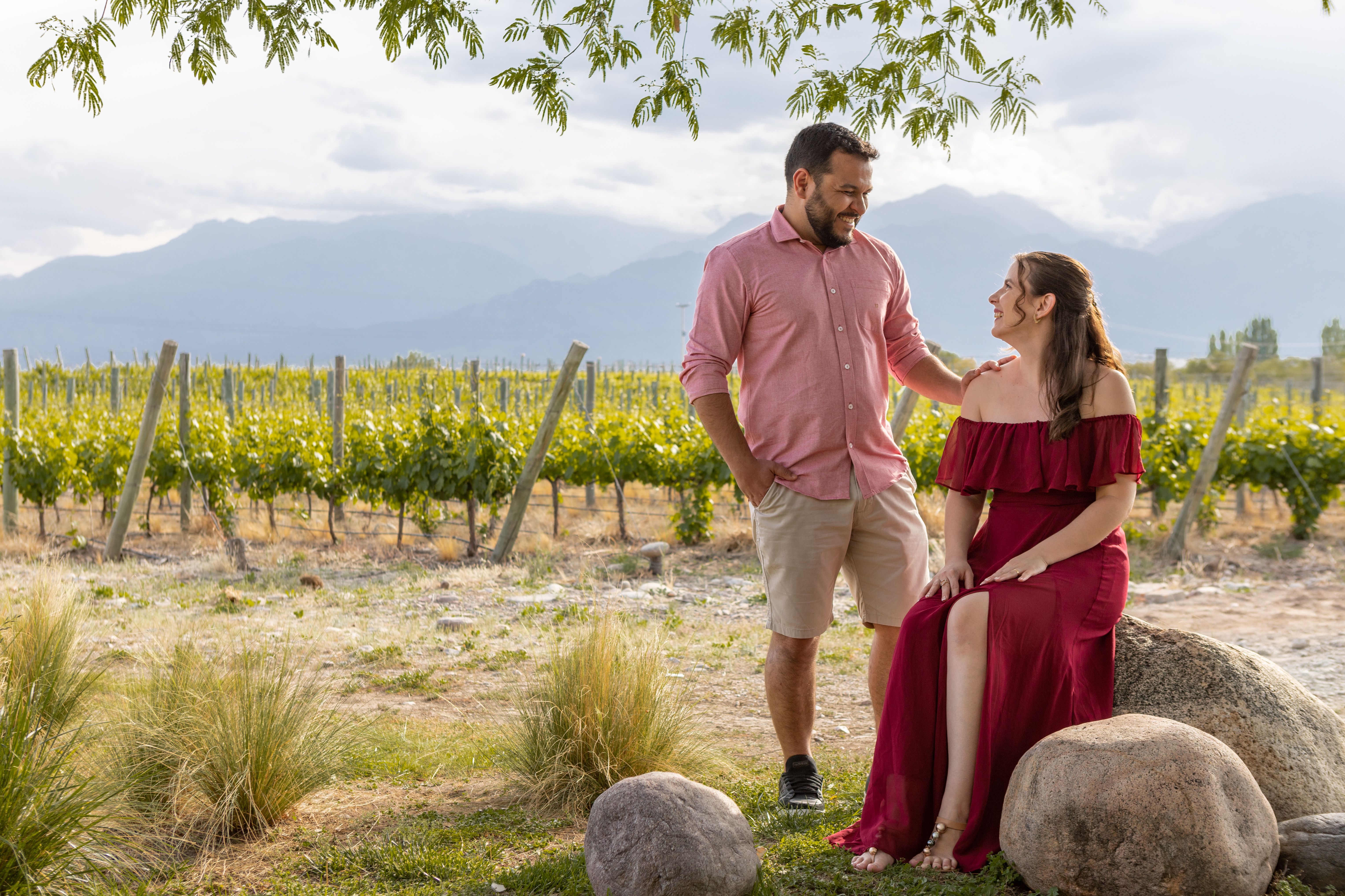 Smiling Couple in Pink Shirt and Red Dress · Free Stock Photo