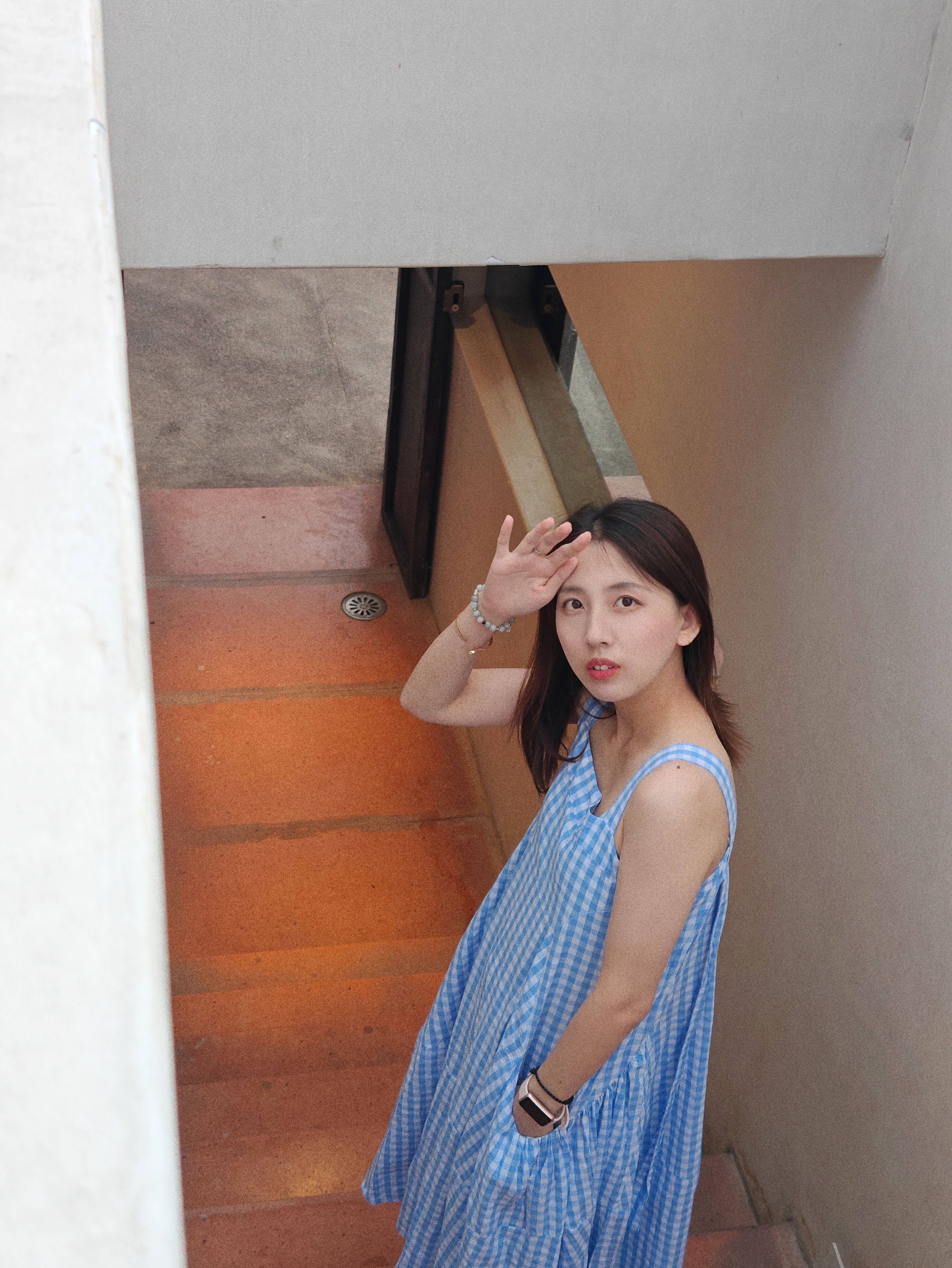 Woman in Blue Sundress Standing with Arm Raised and Hand in Pocket ...
