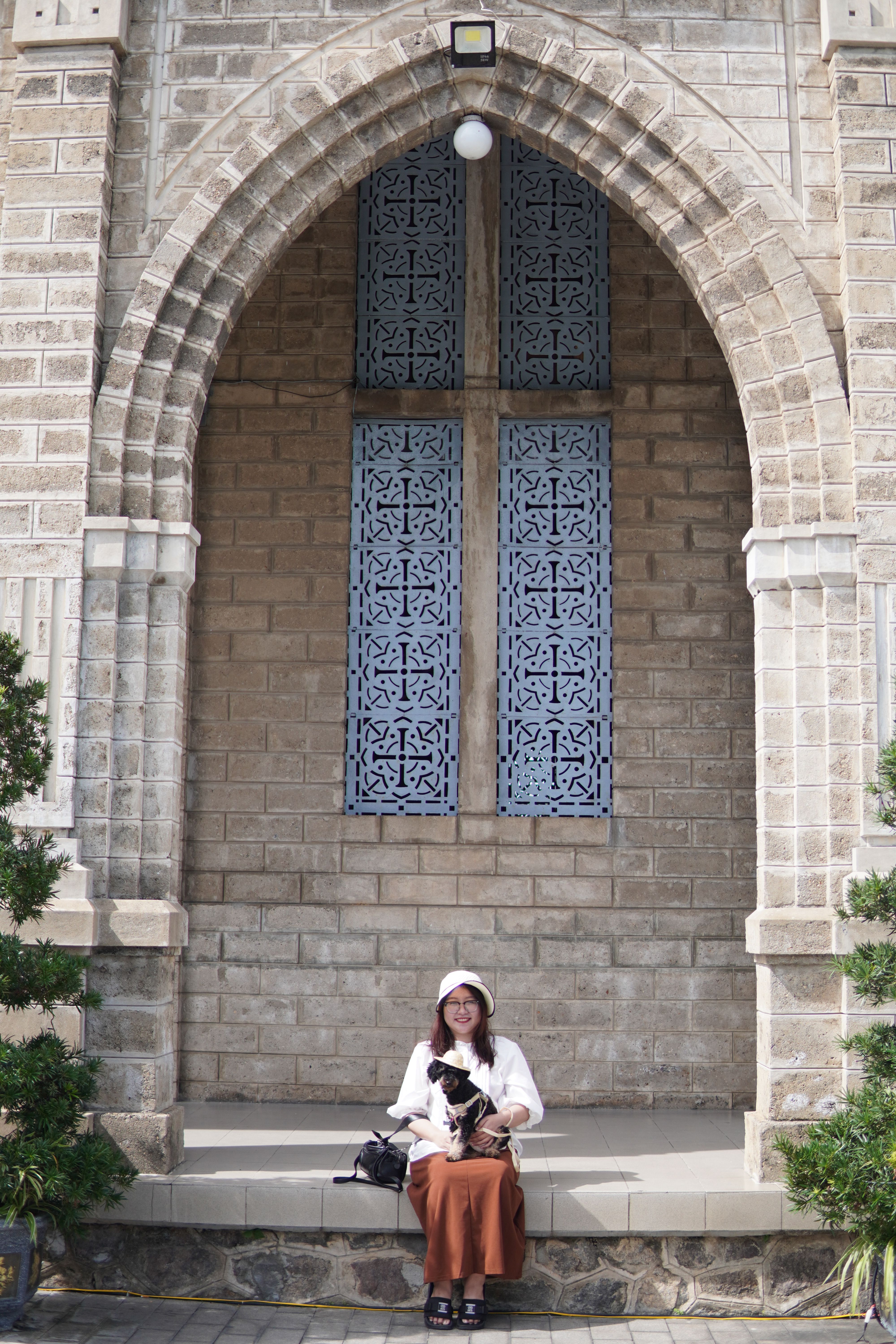 Woman Sitting under Arch · Free Stock Photo