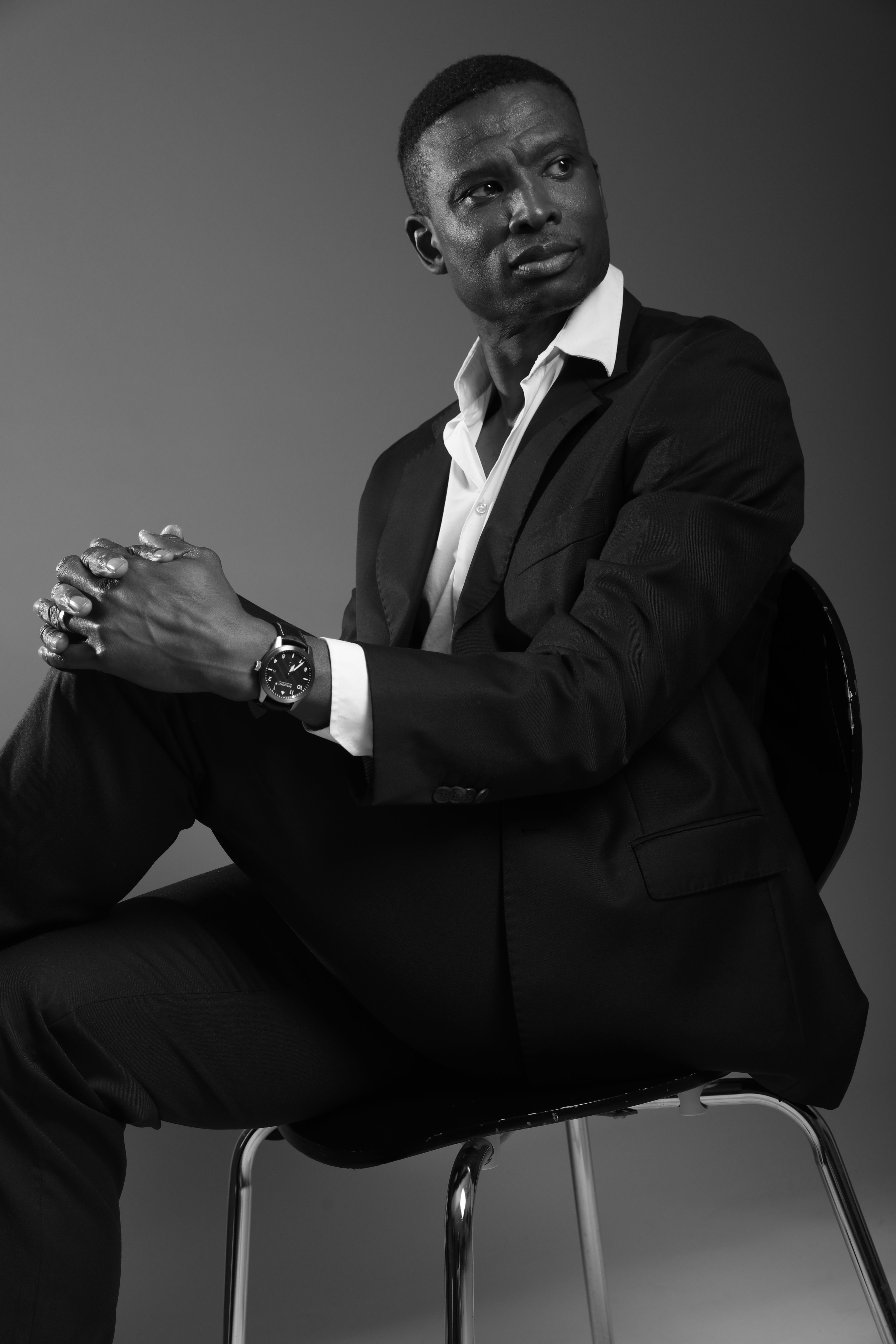 Man Sitting in Suit · Free Stock Photo