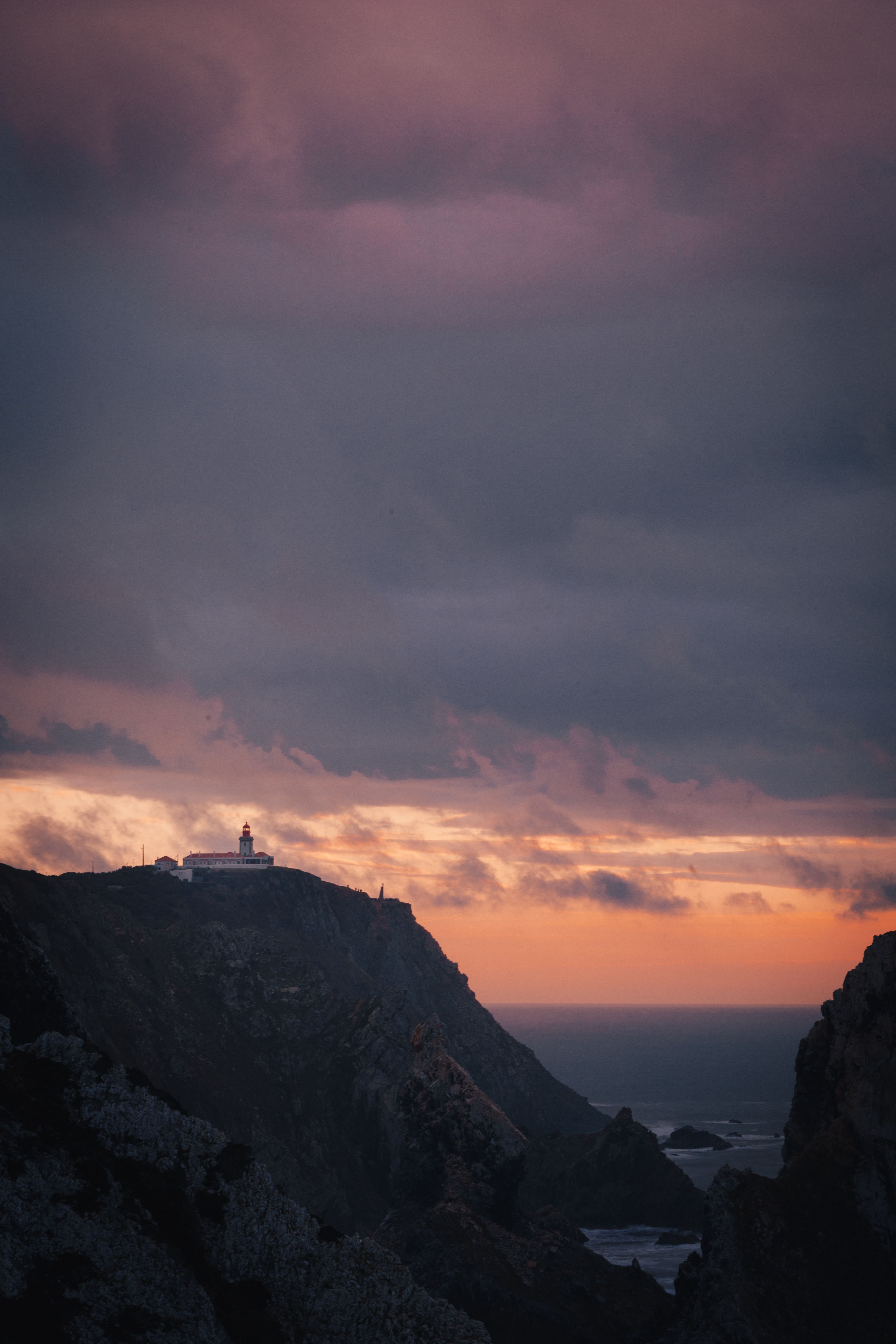 Rain Cloud over Cliff Rocks on Sea Coast · Free Stock Photo