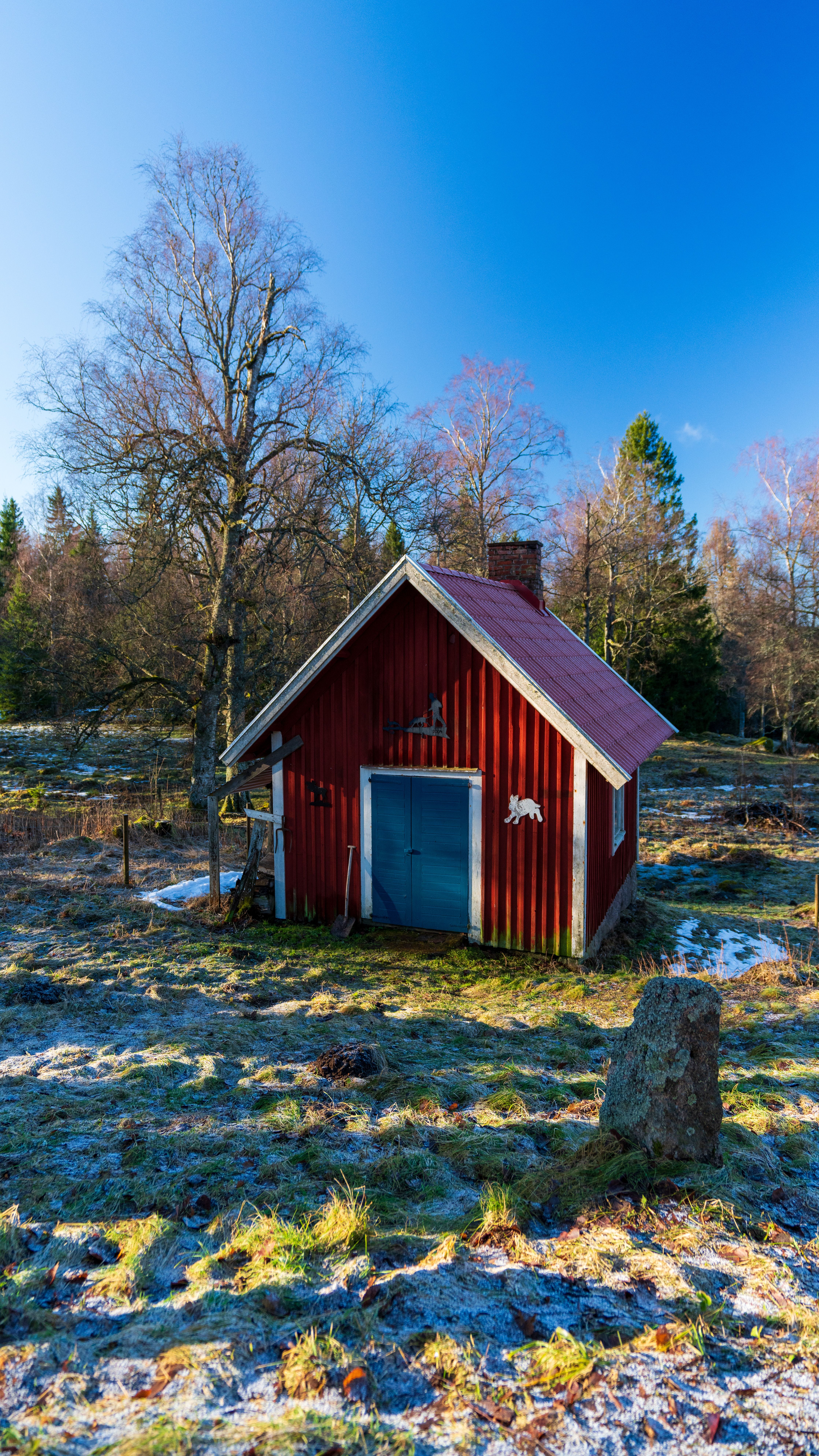 A Red Hut Standing on a Frosty Field · Free Stock Photo