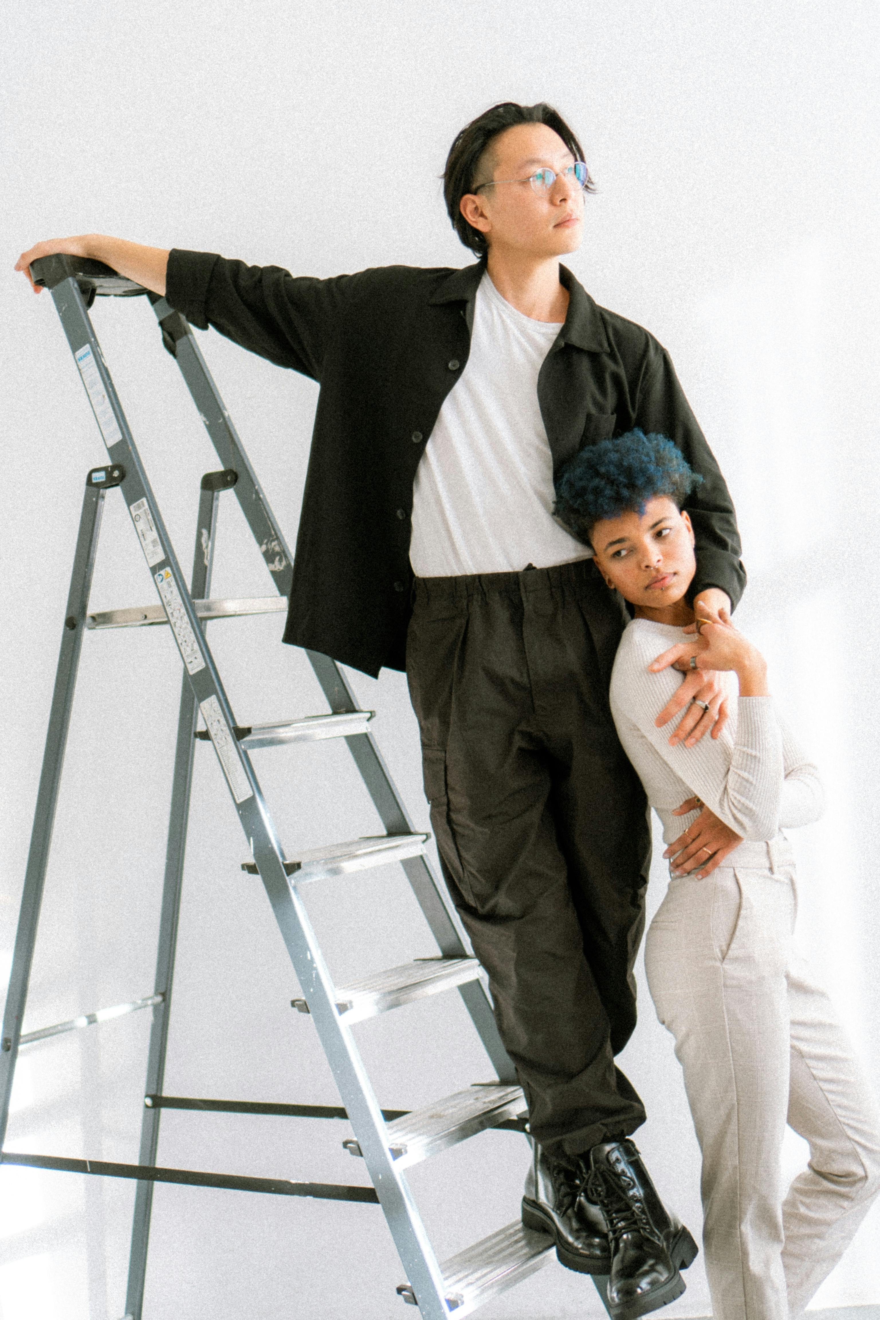 Man Standing on Ladder and Hugging Woman · Free Stock Photo