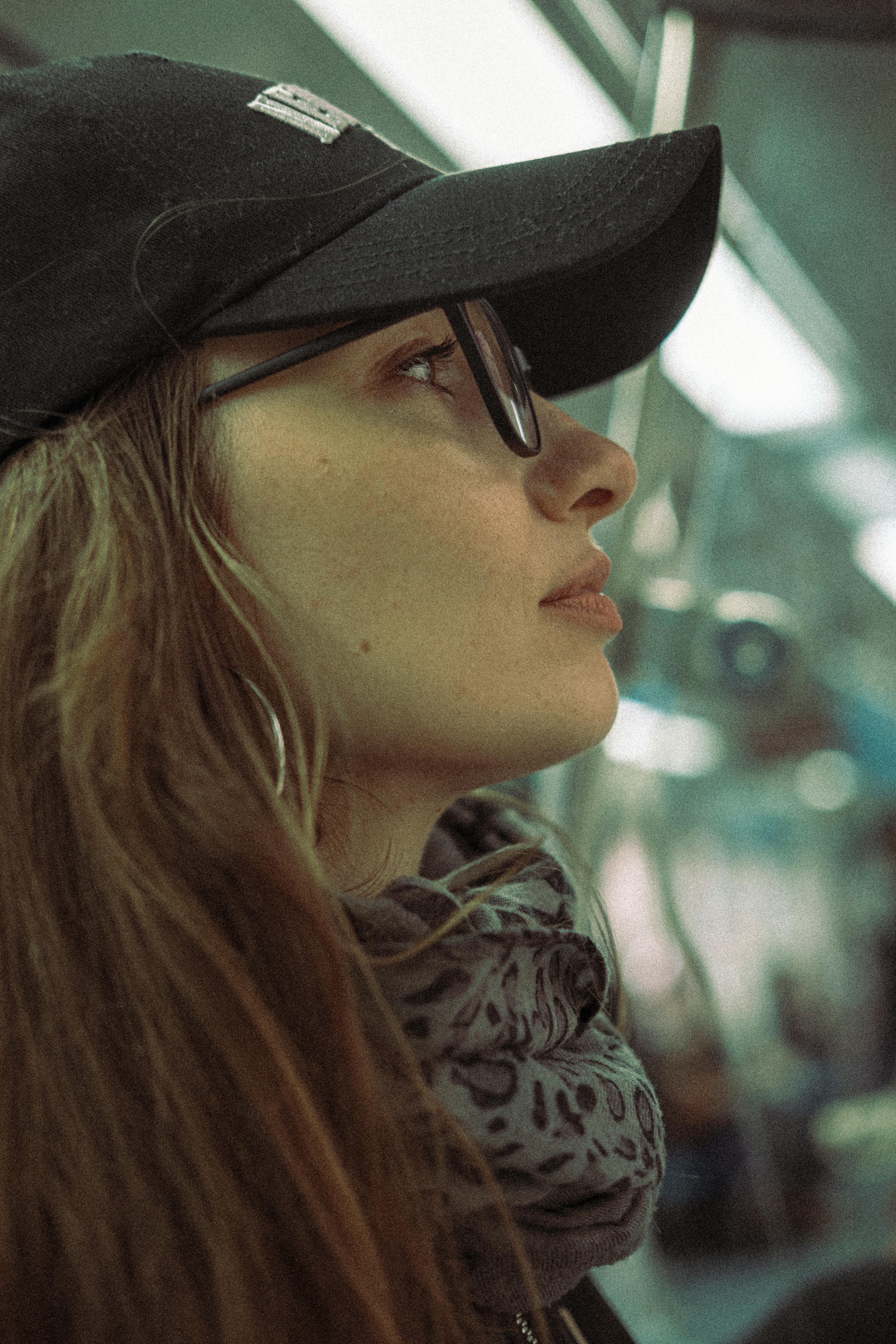Side View of a Young Woman in Eyeglasses and Baseball Cap · Free Stock ...