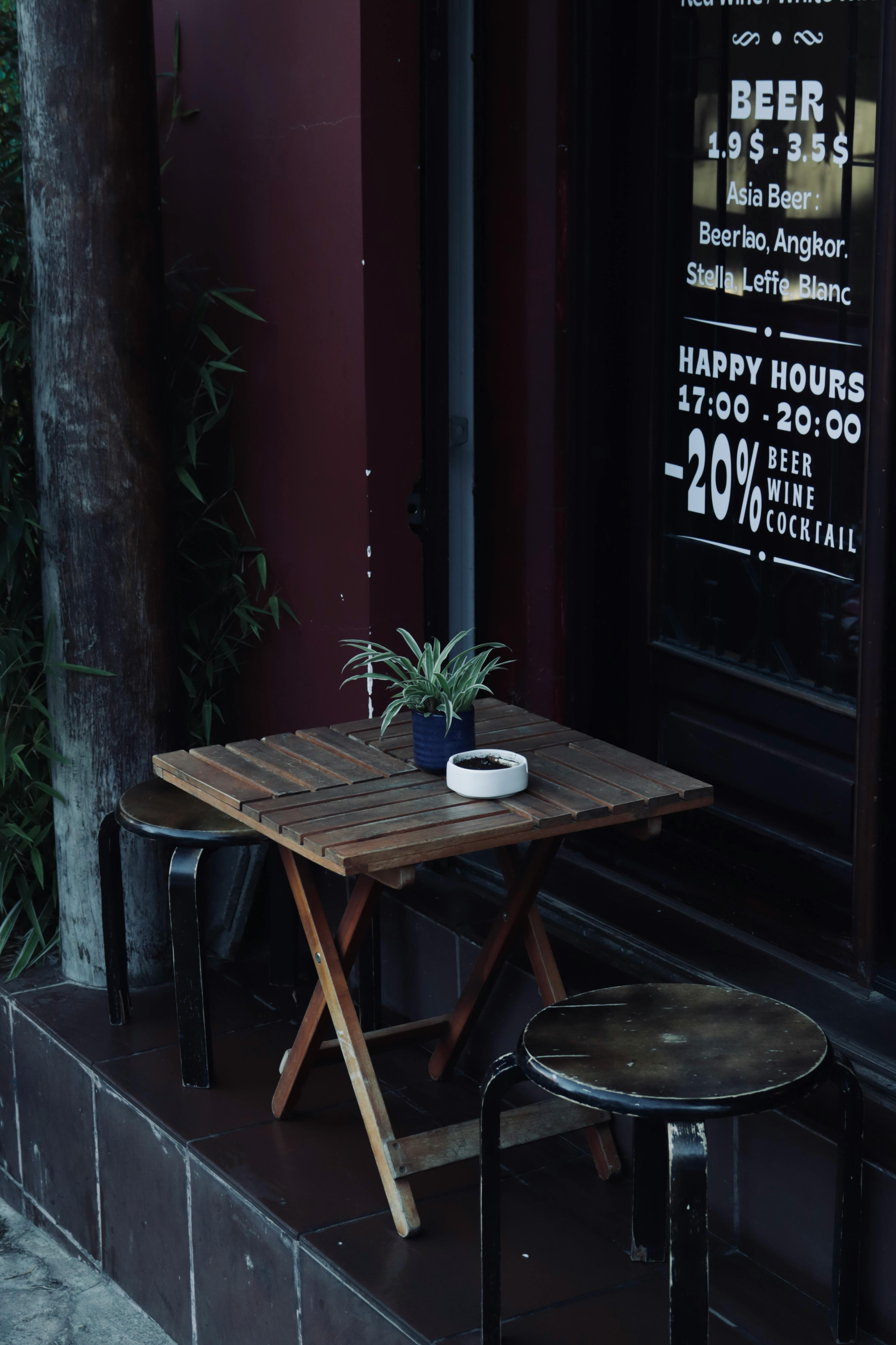 Back View of a Woman Entering a Restaurant · Free Stock Photo