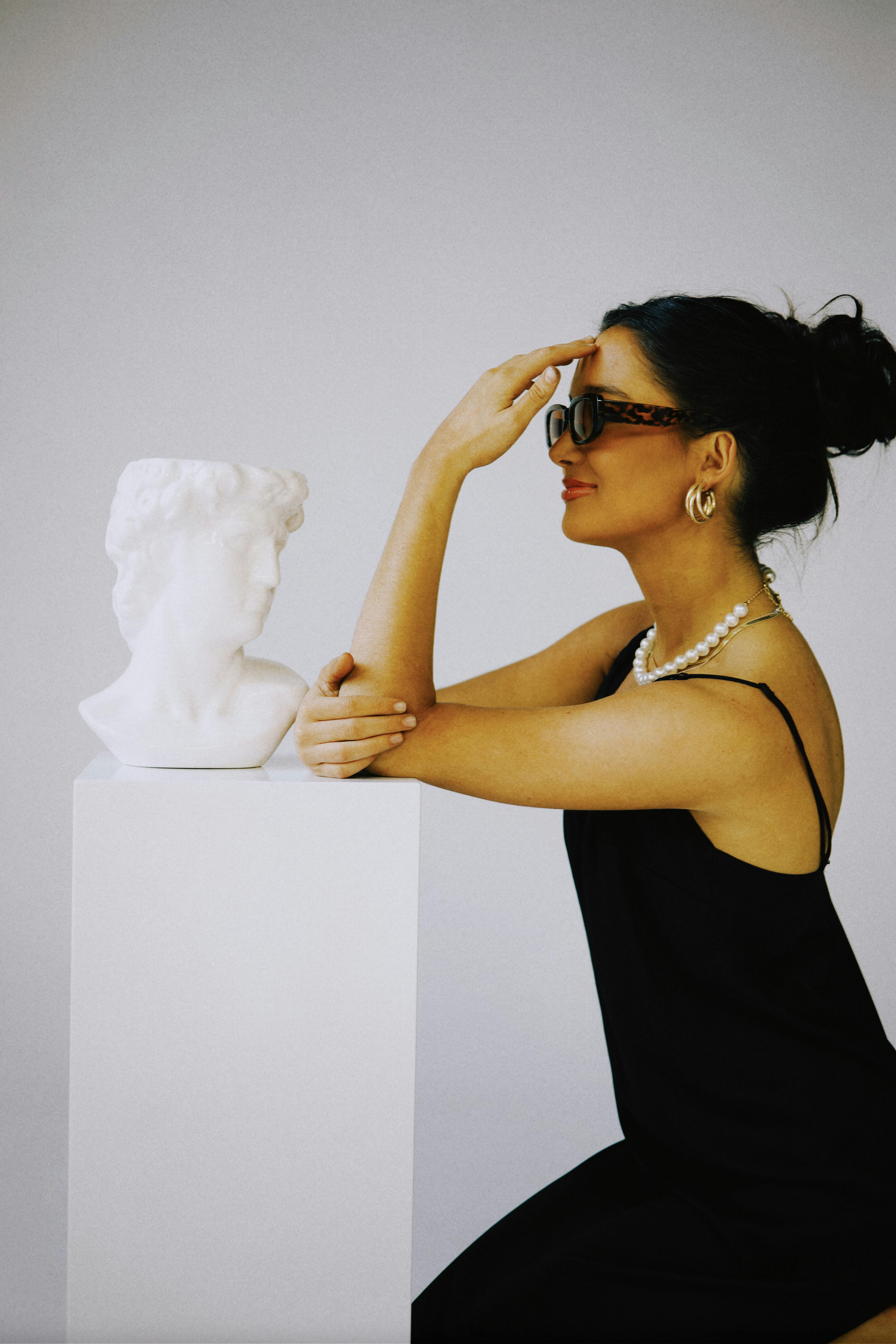 Woman Posing with a Sculpture · Free Stock Photo