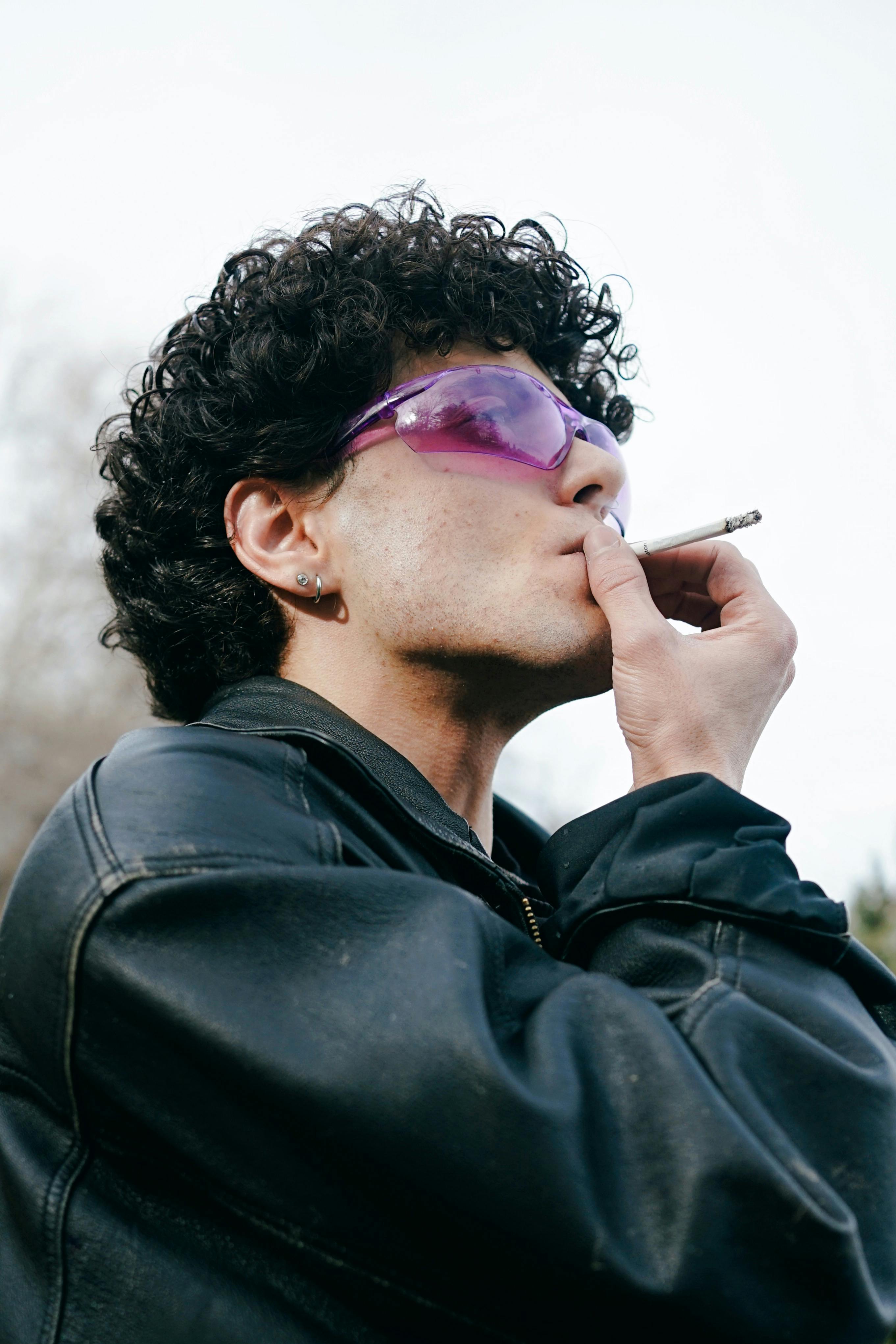 A Curly Hair Woman Smoking Weed · Free Stock Photo