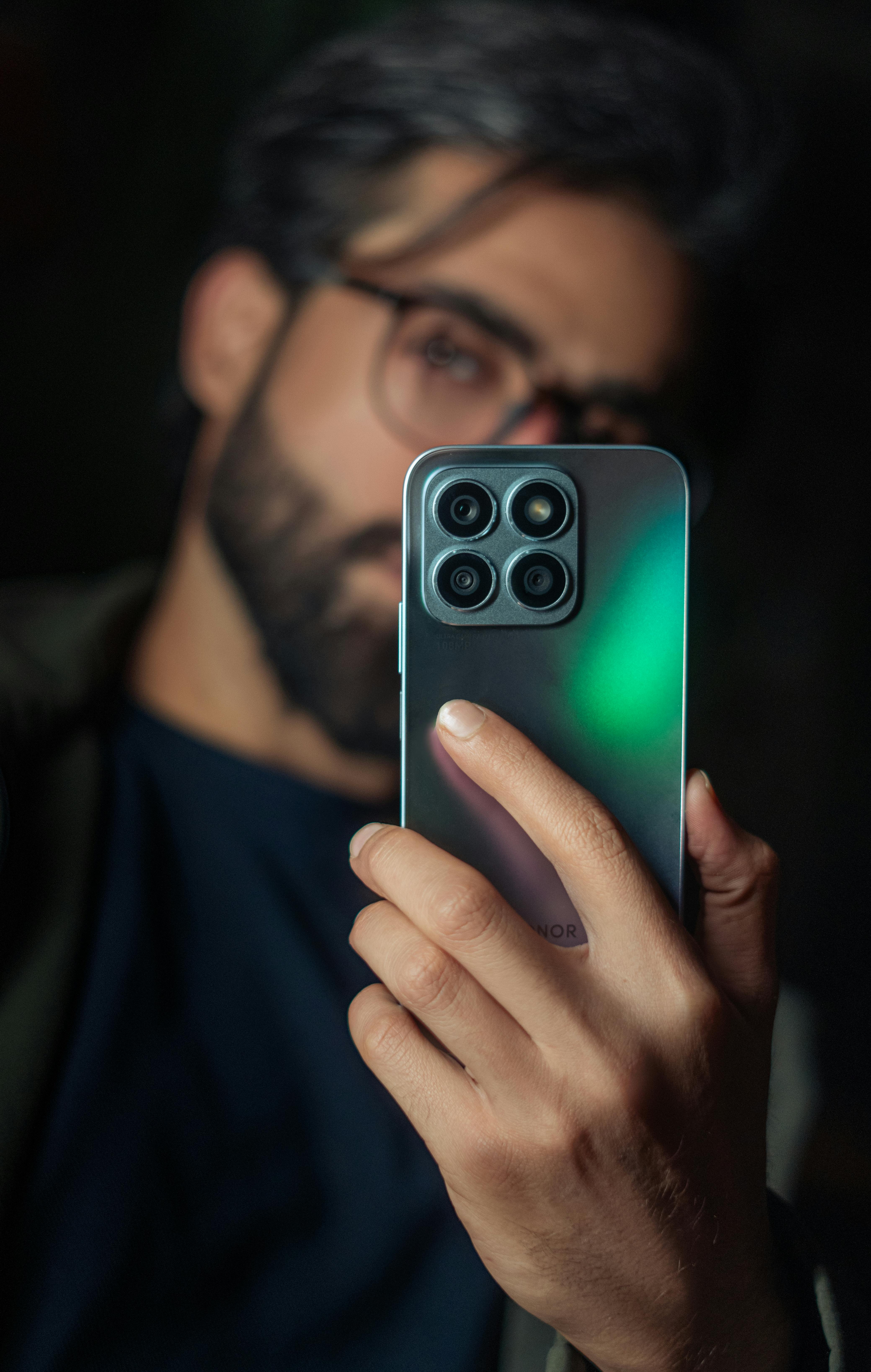 Man Hand Holding Smartphone and Taking Pictures · Free Stock Photo