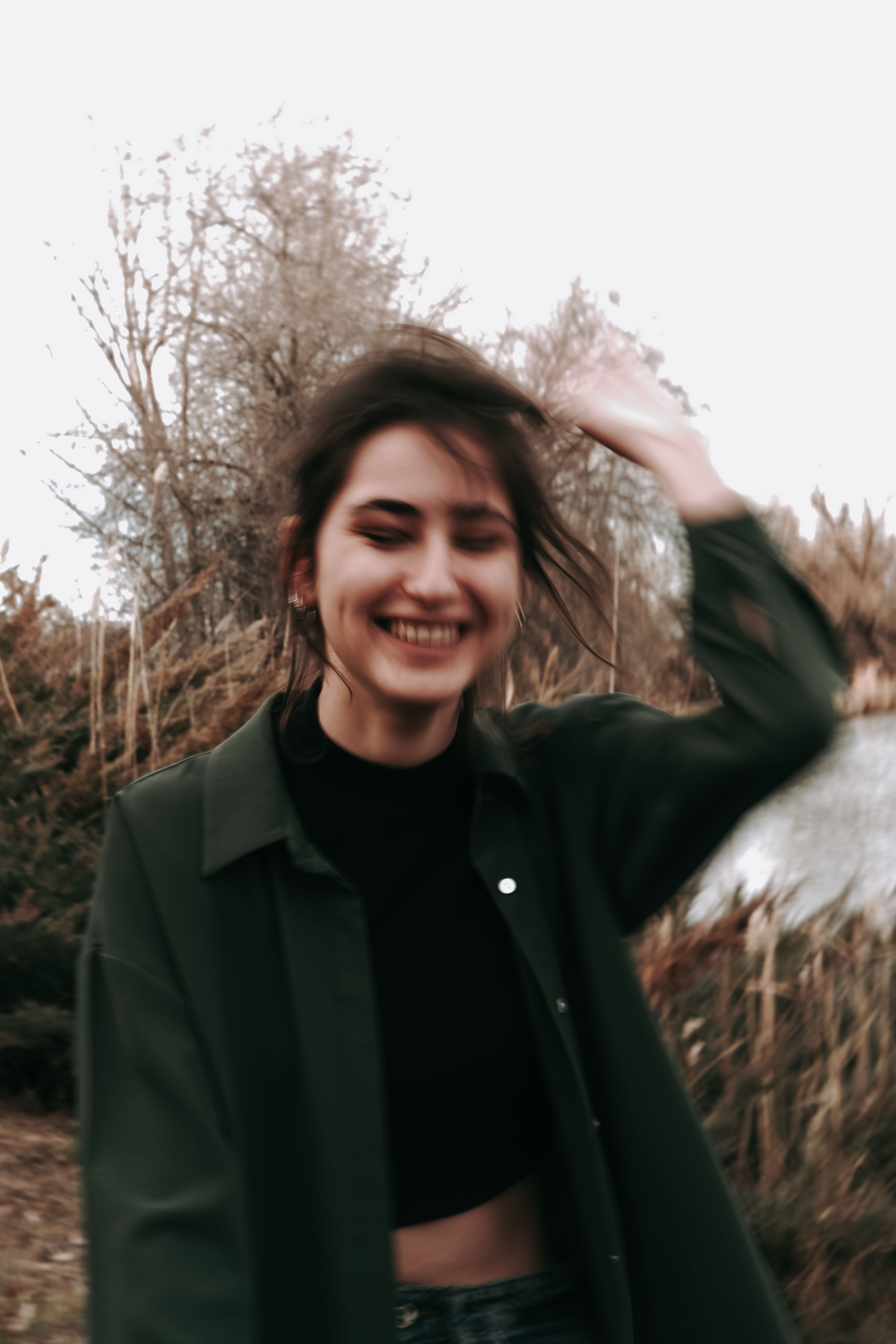 Smiling Woman Moving her Arm · Free Stock Photo