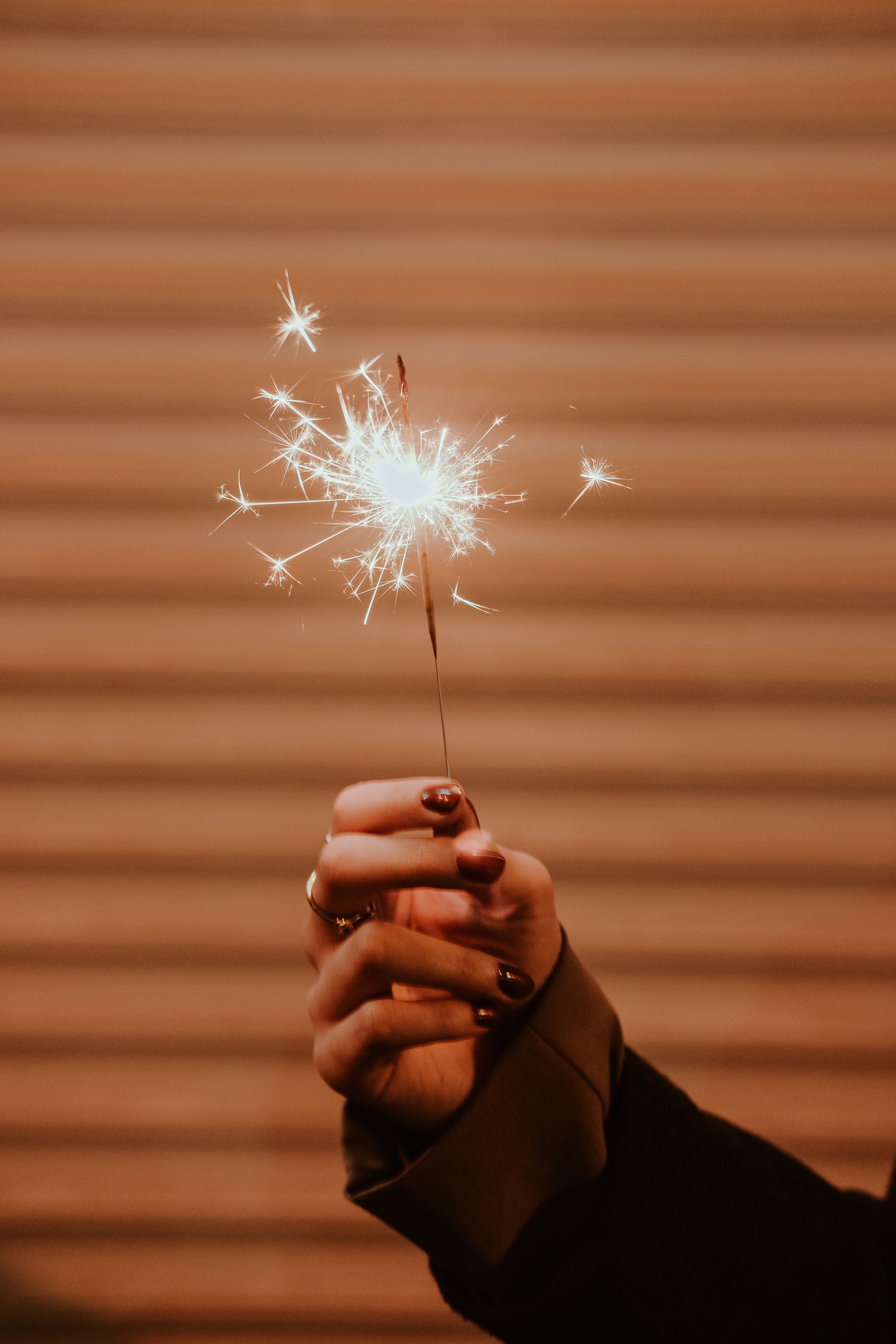 Hand Holding Sparkler in Winter · Free Stock Photo