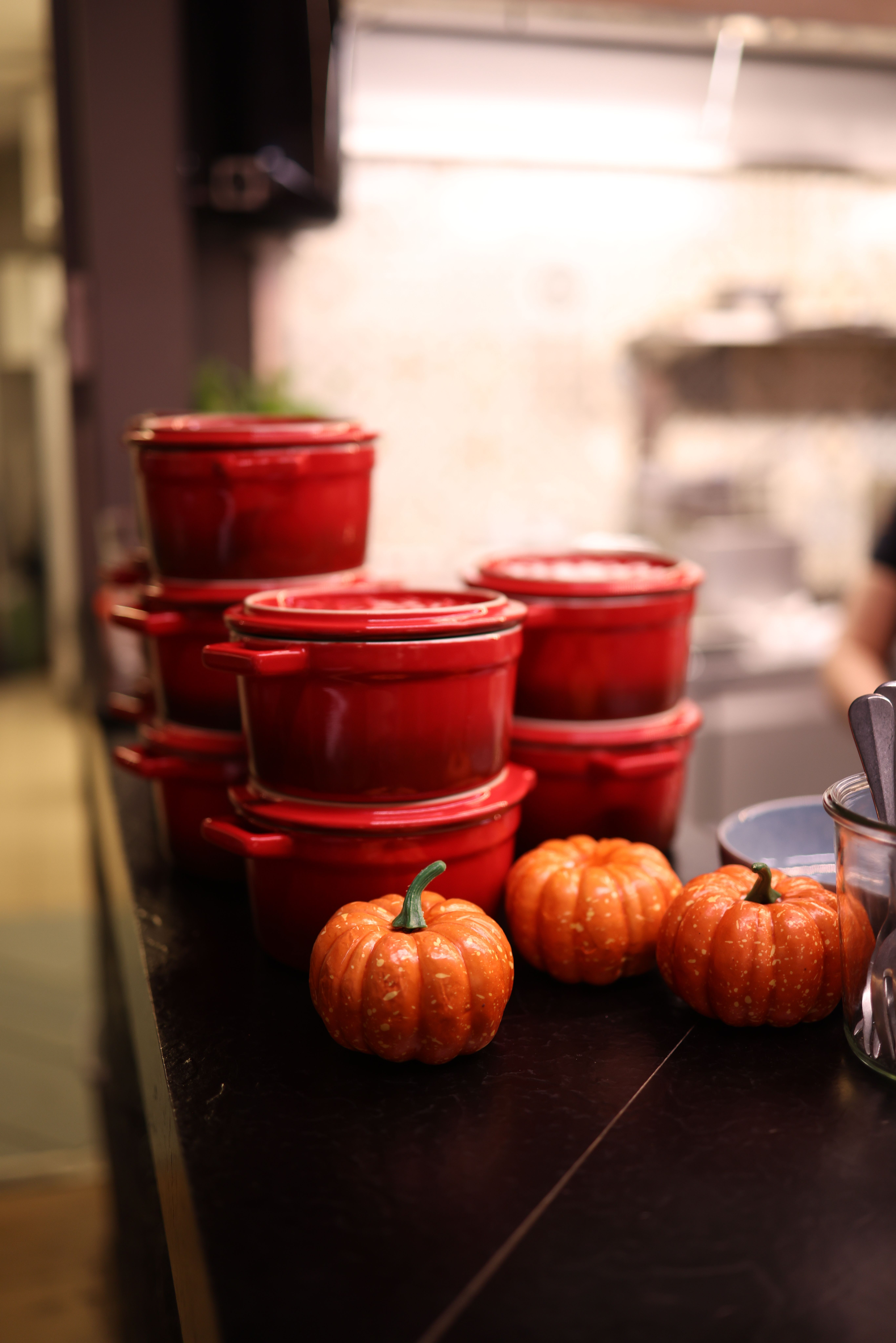 Red Pots and Pumpkins on Counter in Kitchen · Free Stock Photo