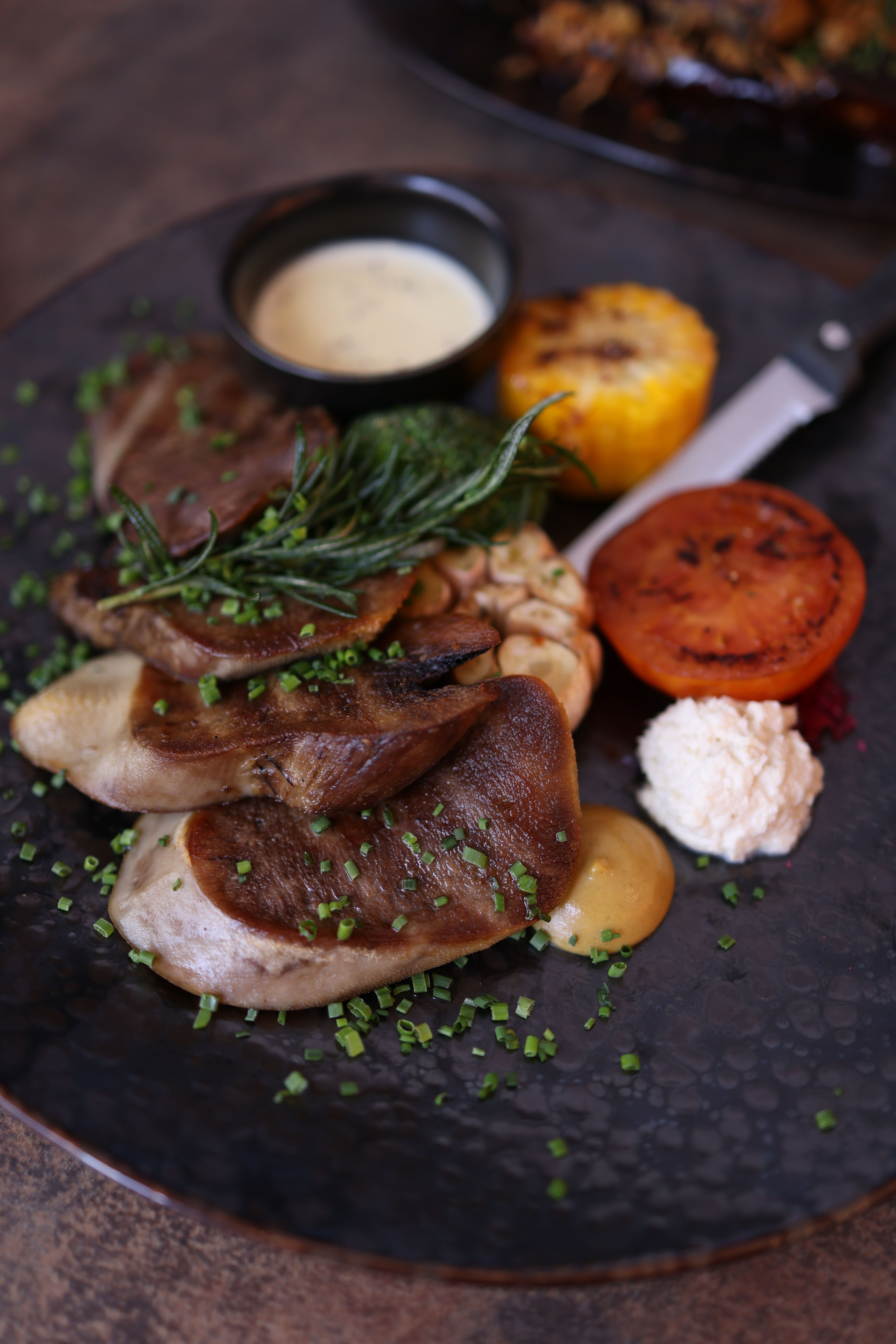 Close-up of a Gourmet Dish with Meat and Vegetables · Free Stock Photo