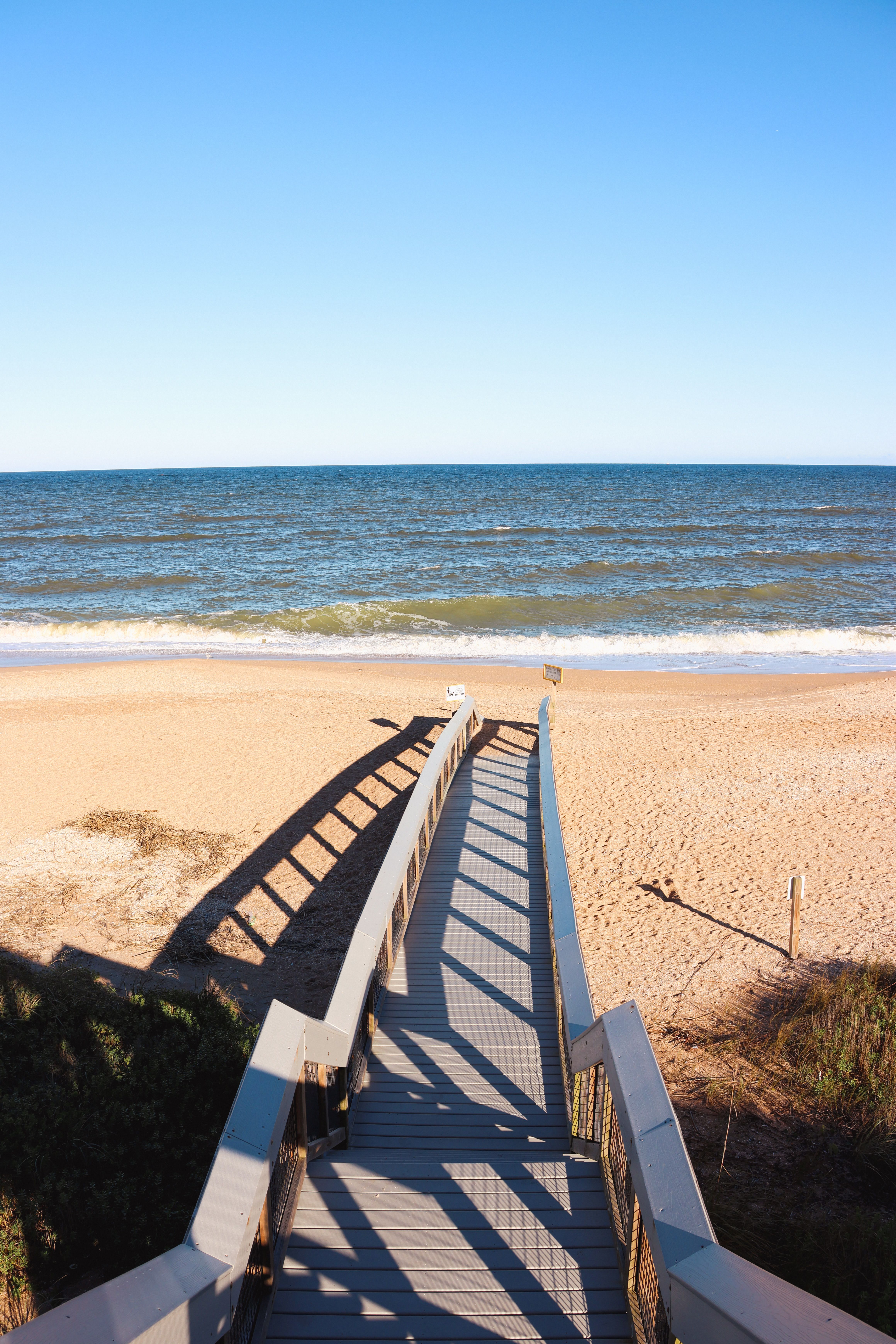 Sunlit Boardwalk on Beach · Free Stock Photo