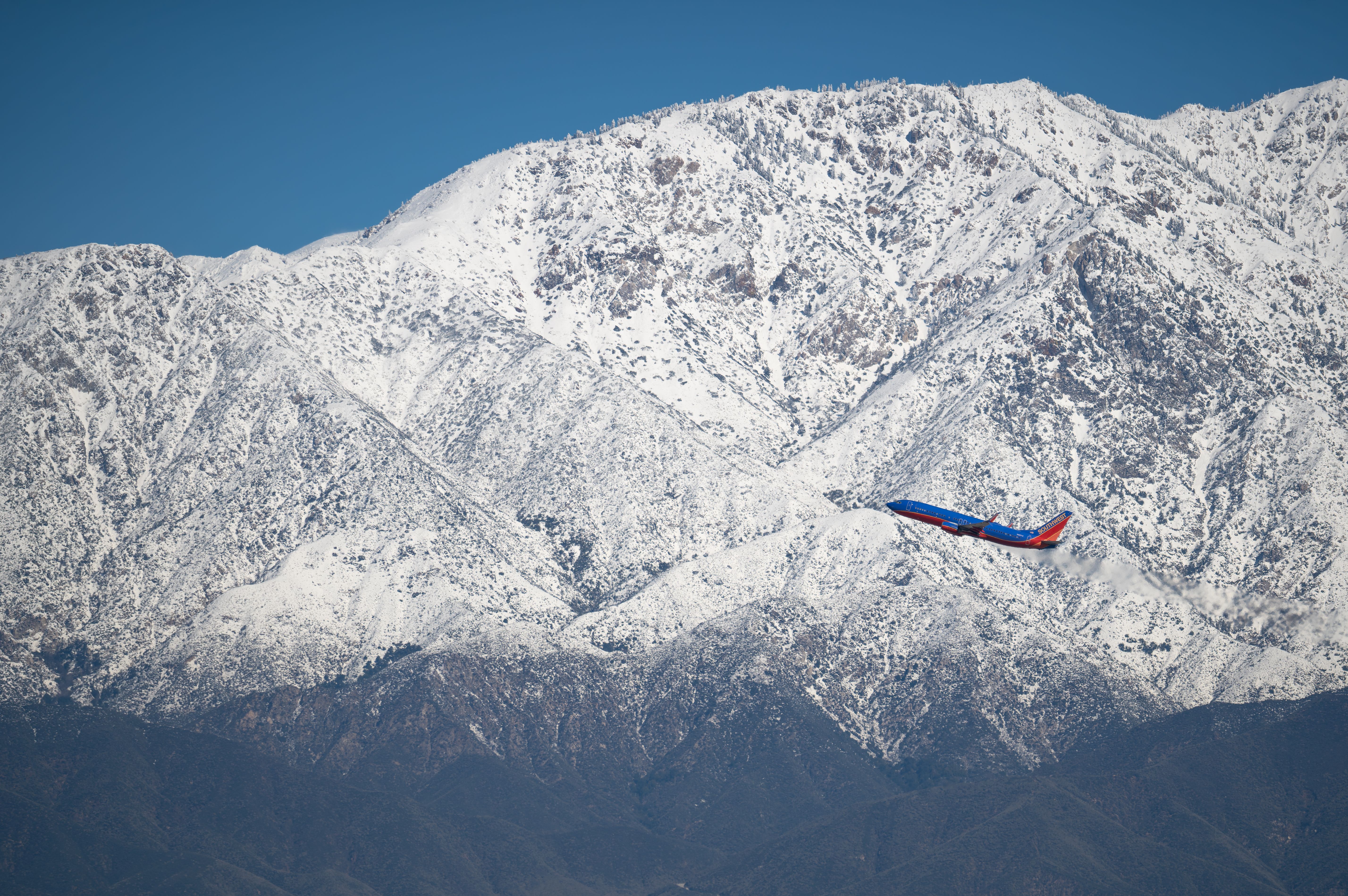 Passenger Plane Rising Against the Background of a Snow-covered ...