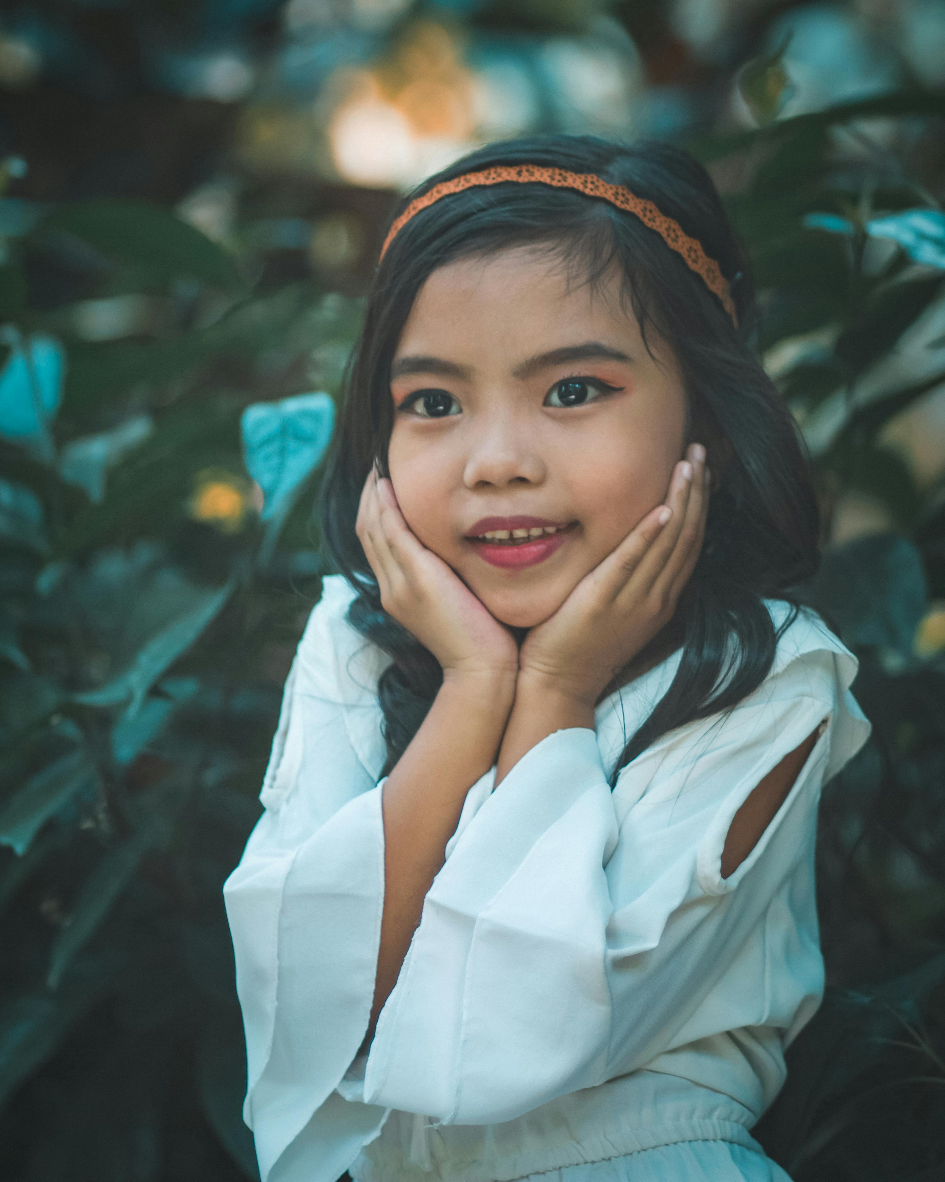 Girl Holding Her Face · Free Stock Photo