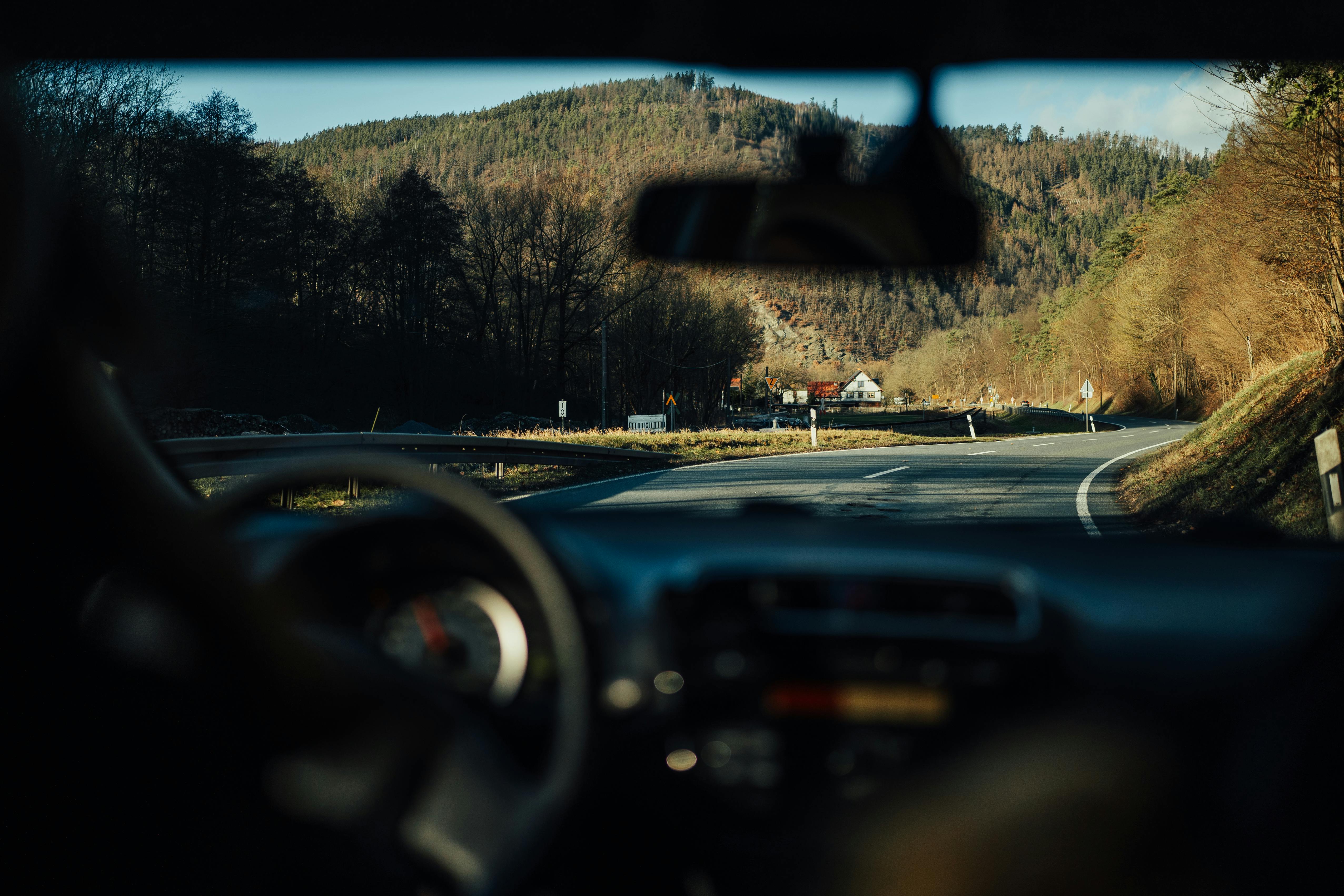 View of the Road Ahead and Mountains in the Distance from the Front Car ...