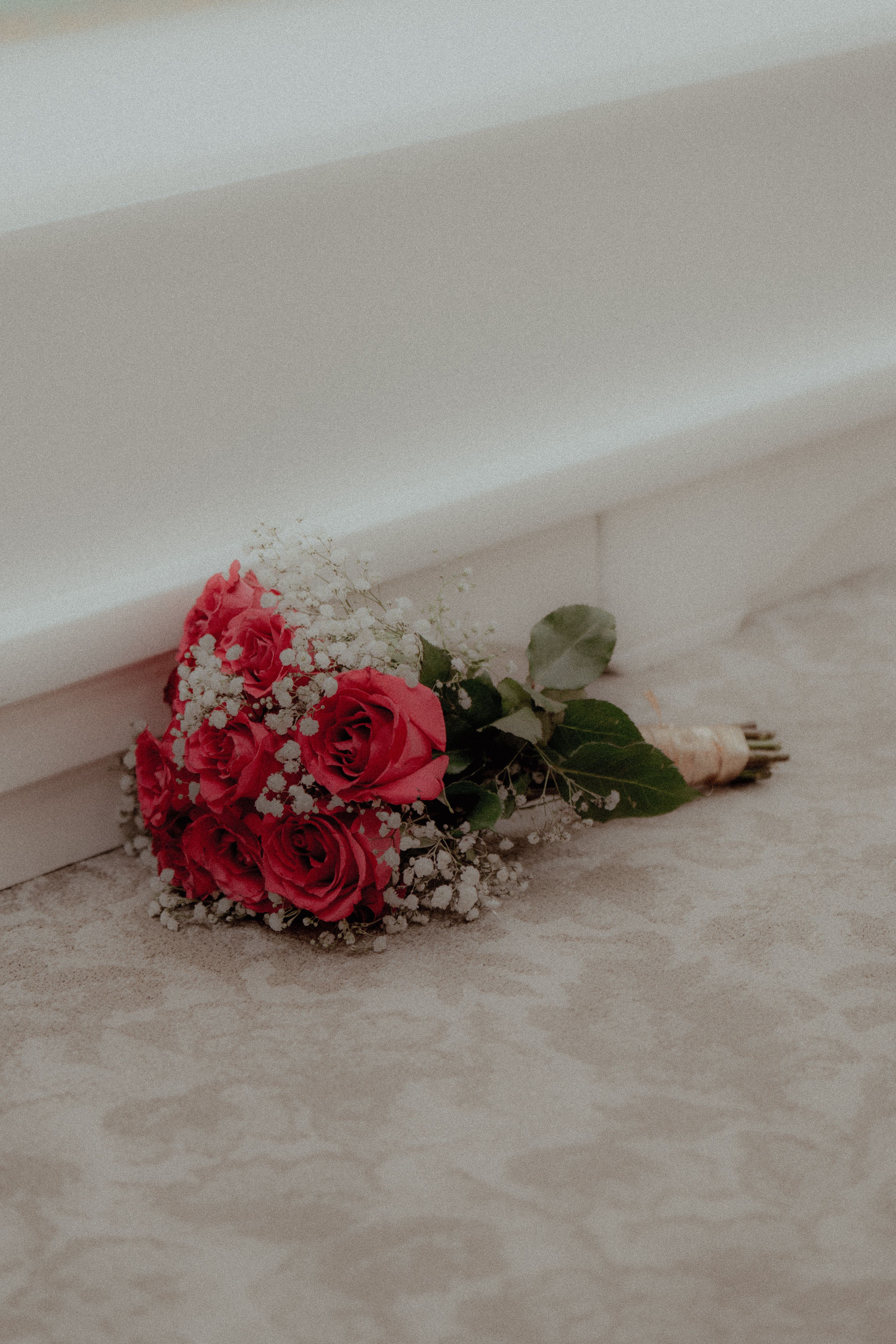 Close-up of a Bouquet of Pink Roses Lying on the Floor · Free Stock Photo