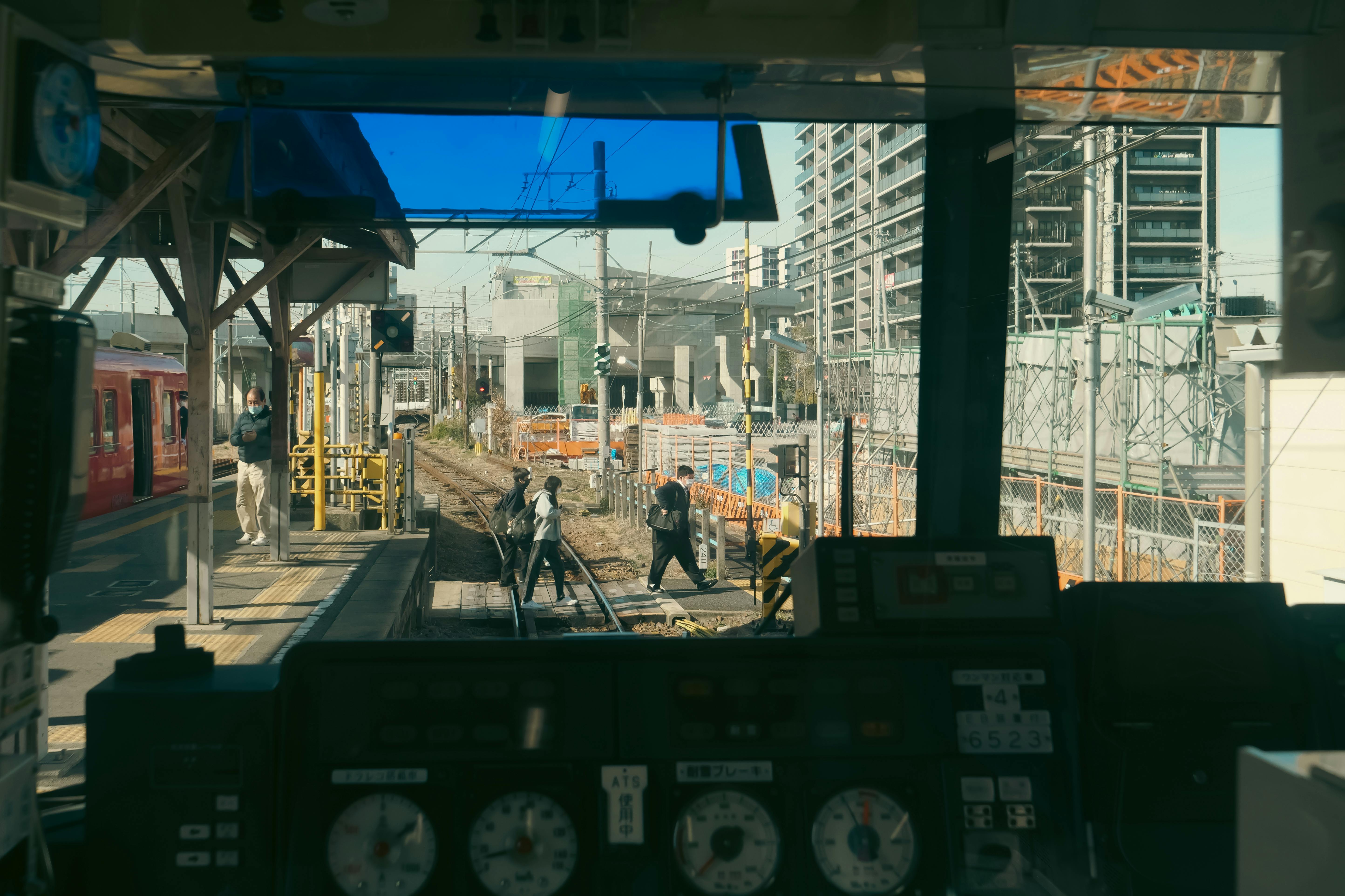 View of a Train Station in City from the Inside of a Train Driver Cab ...