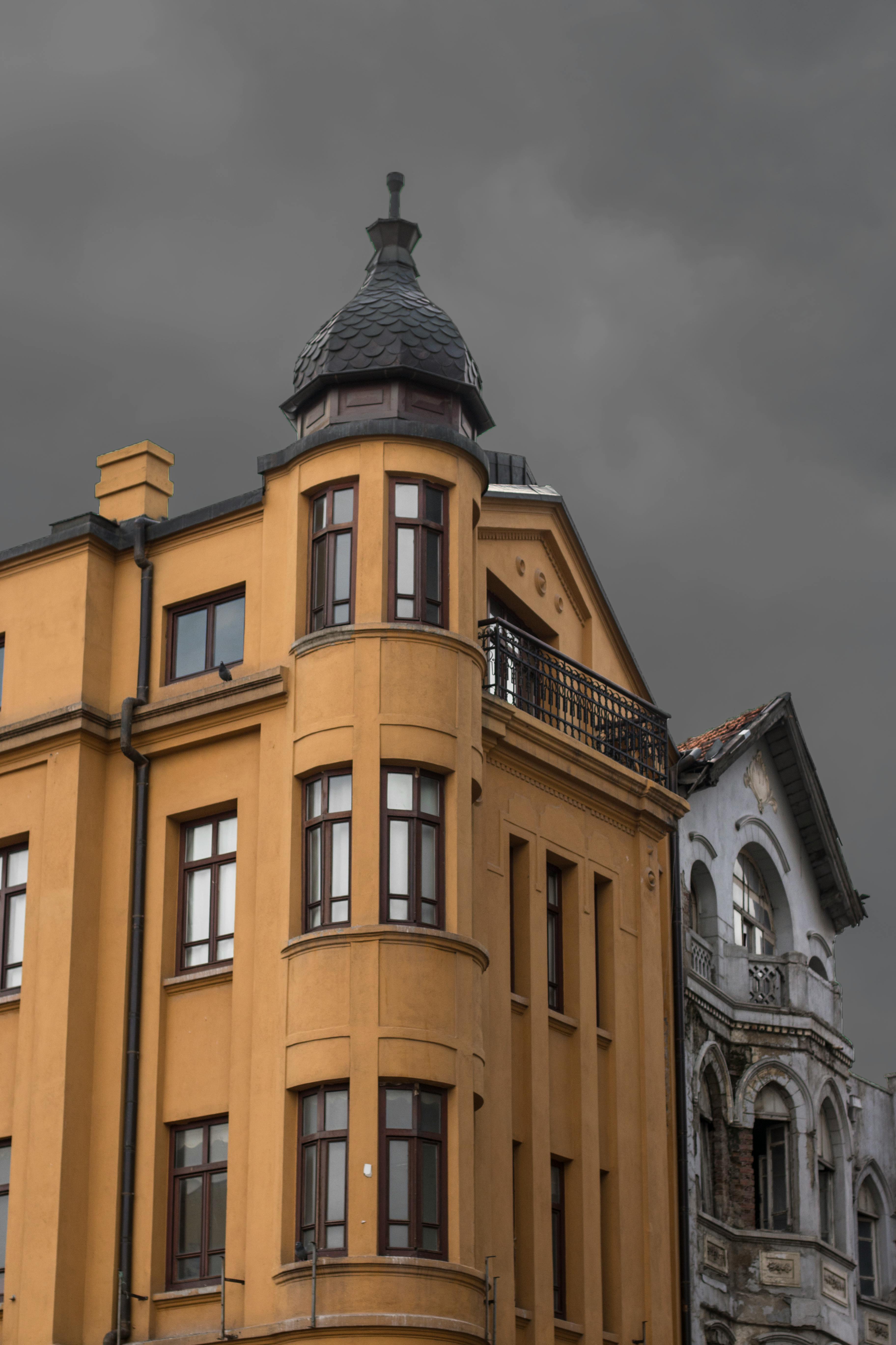 Facade of a Corner Building with a Tower · Free Stock Photo