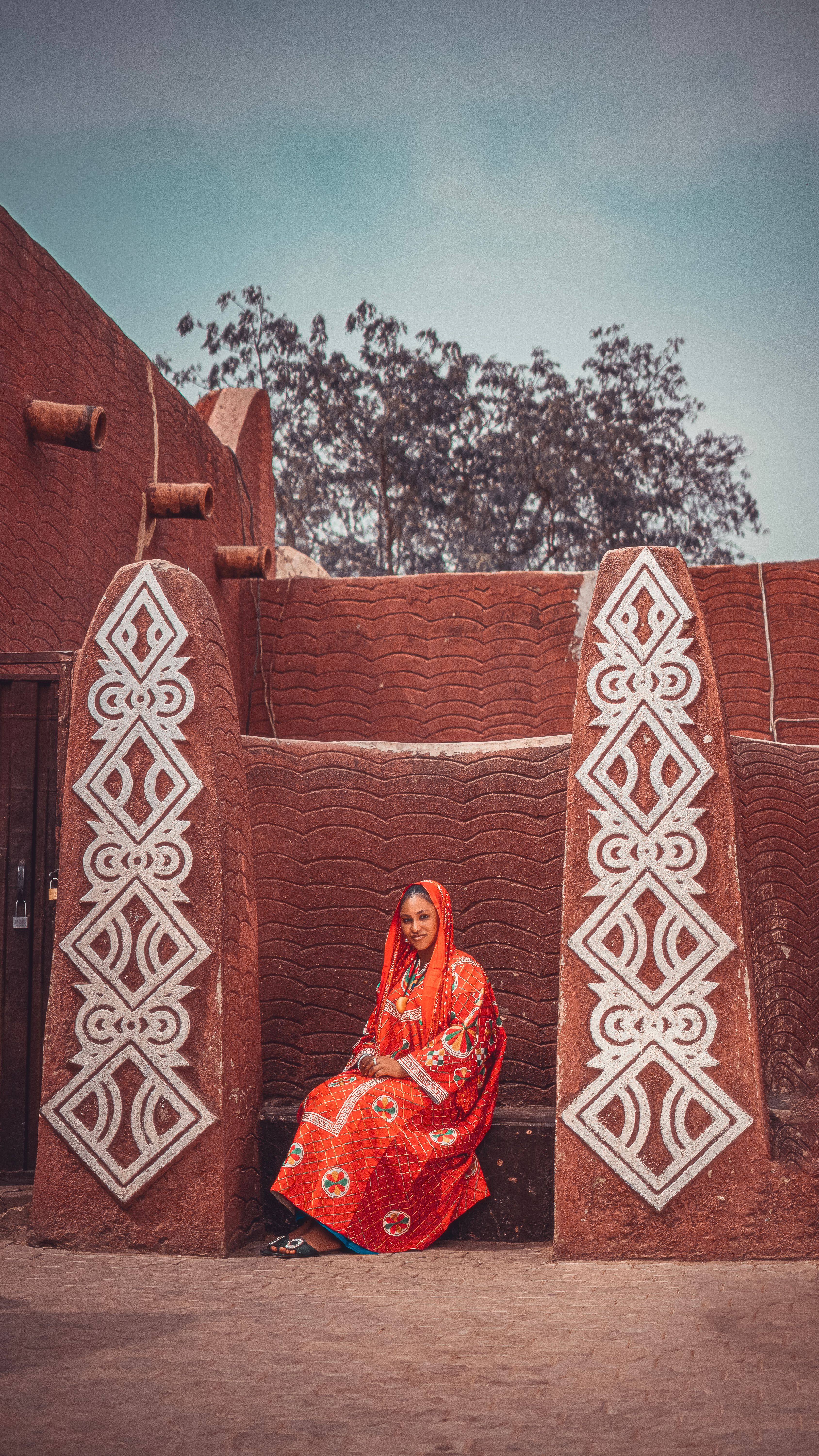 Woman Sitting in Traditional Clothing in Village · Free Stock Photo