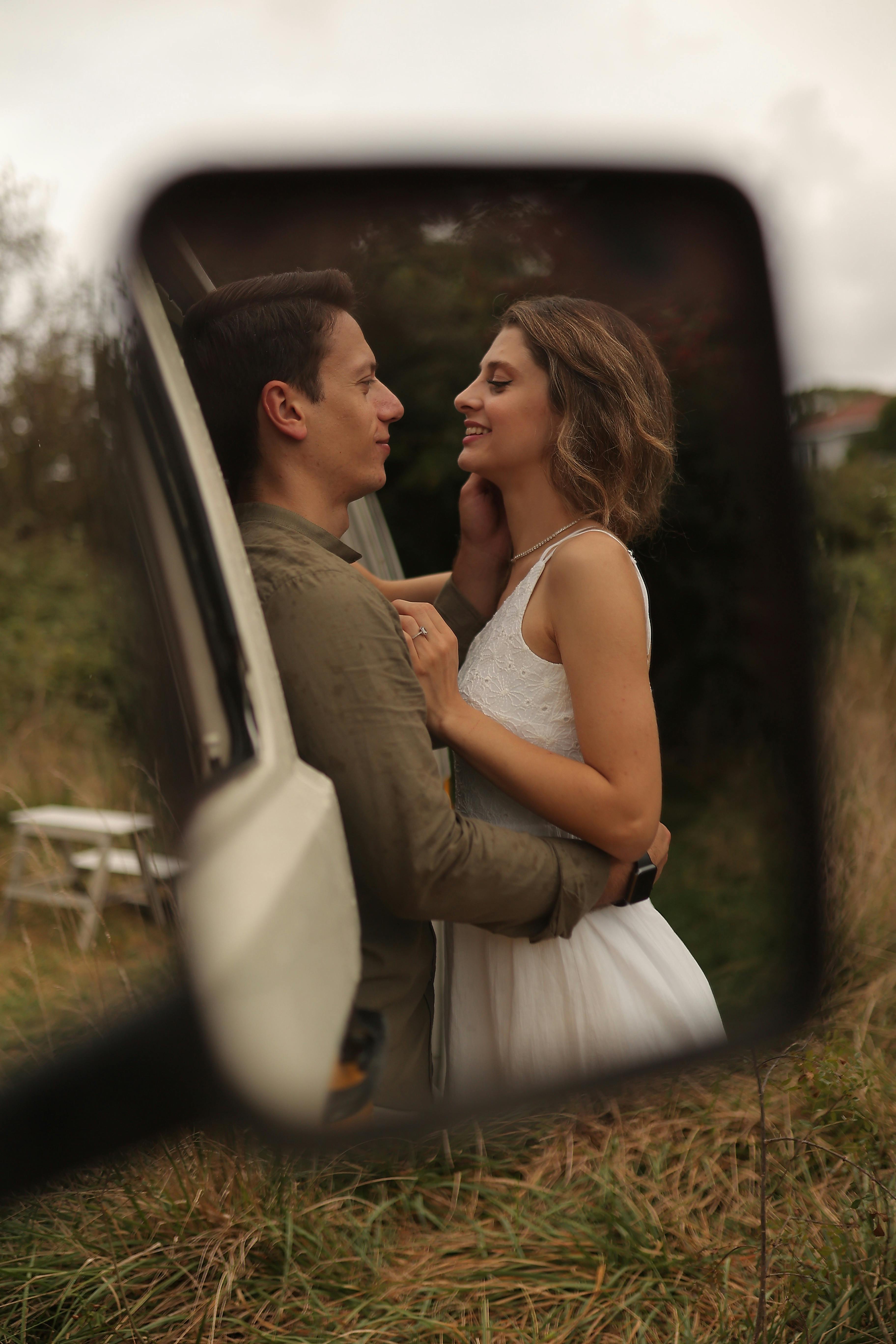 Reflection of Embracing Couple · Free Stock Photo