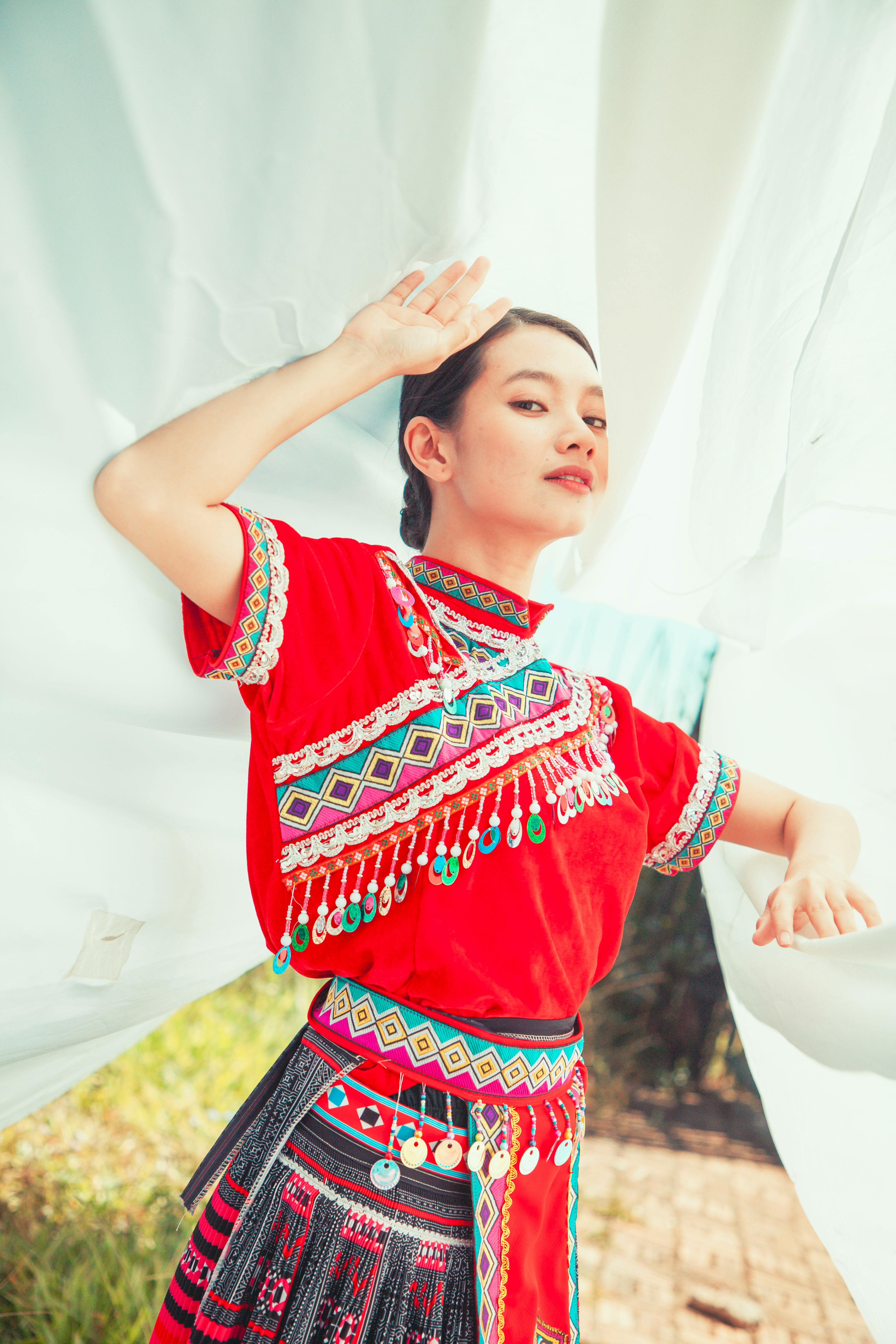 Woman in Traditional Red Dress Dancing Under White Cloth · Free Stock Photo