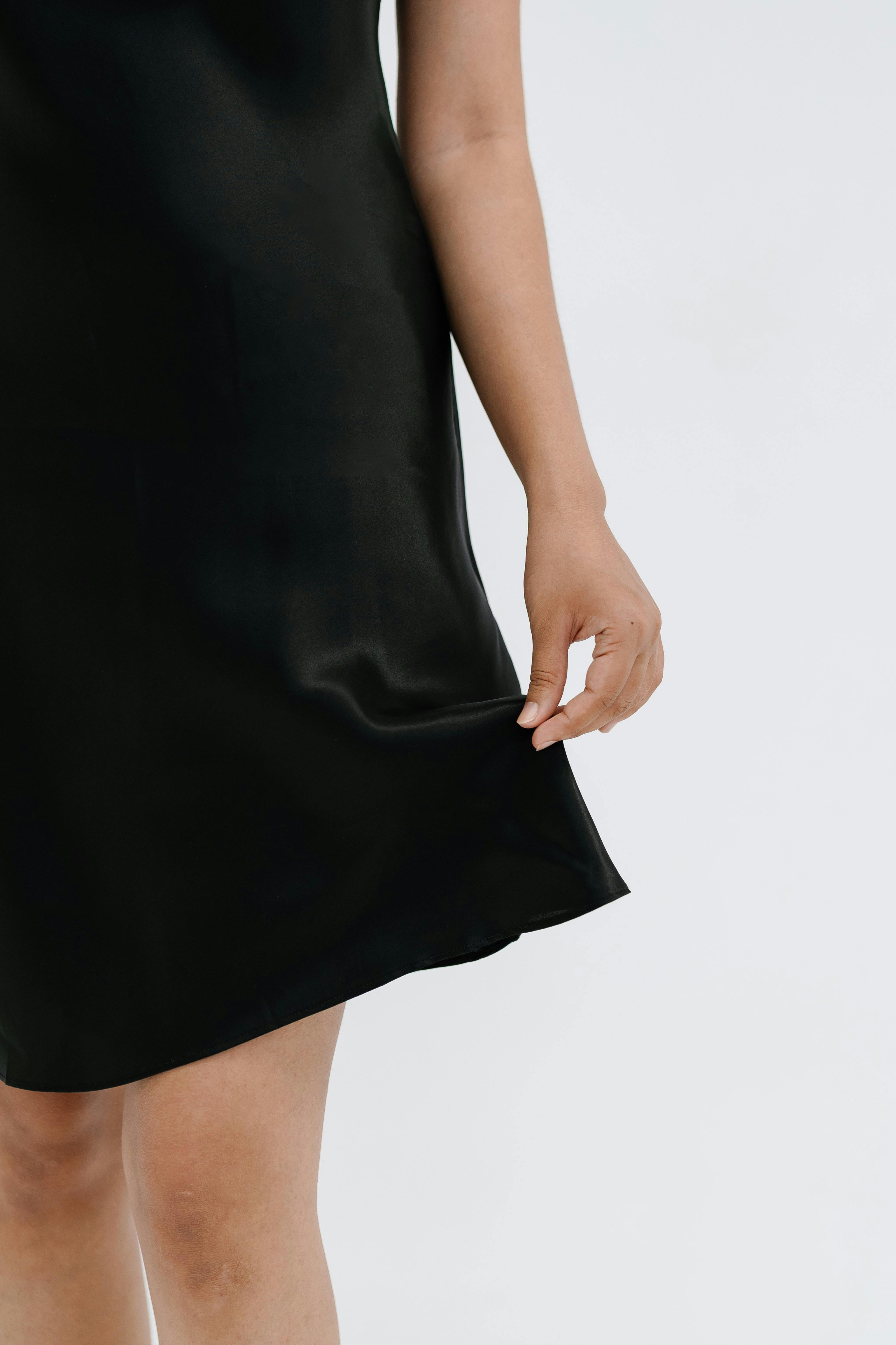 Woman Hand Holding Black Dress · Free Stock Photo