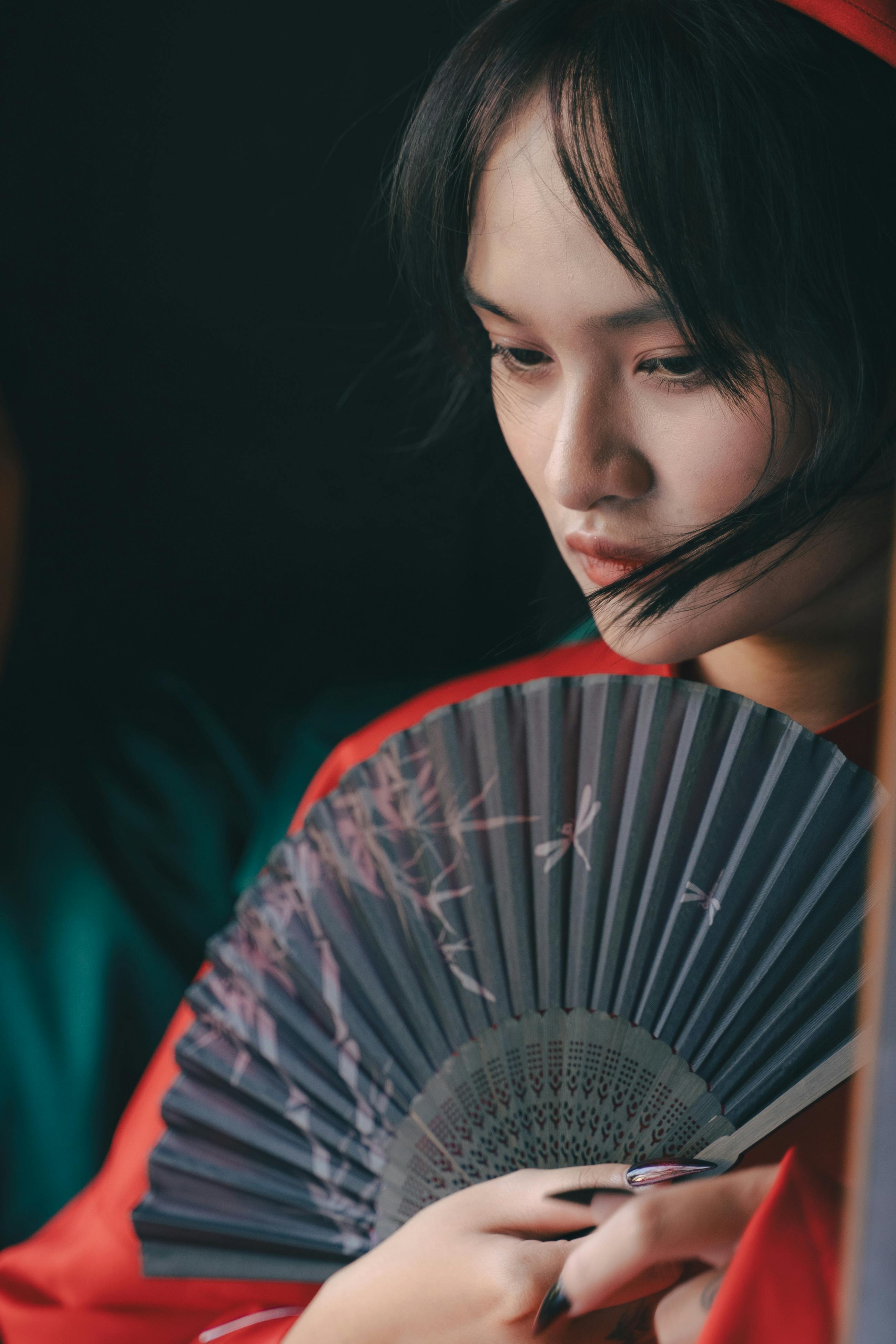 Woman with Traditional Fan · Free Stock Photo