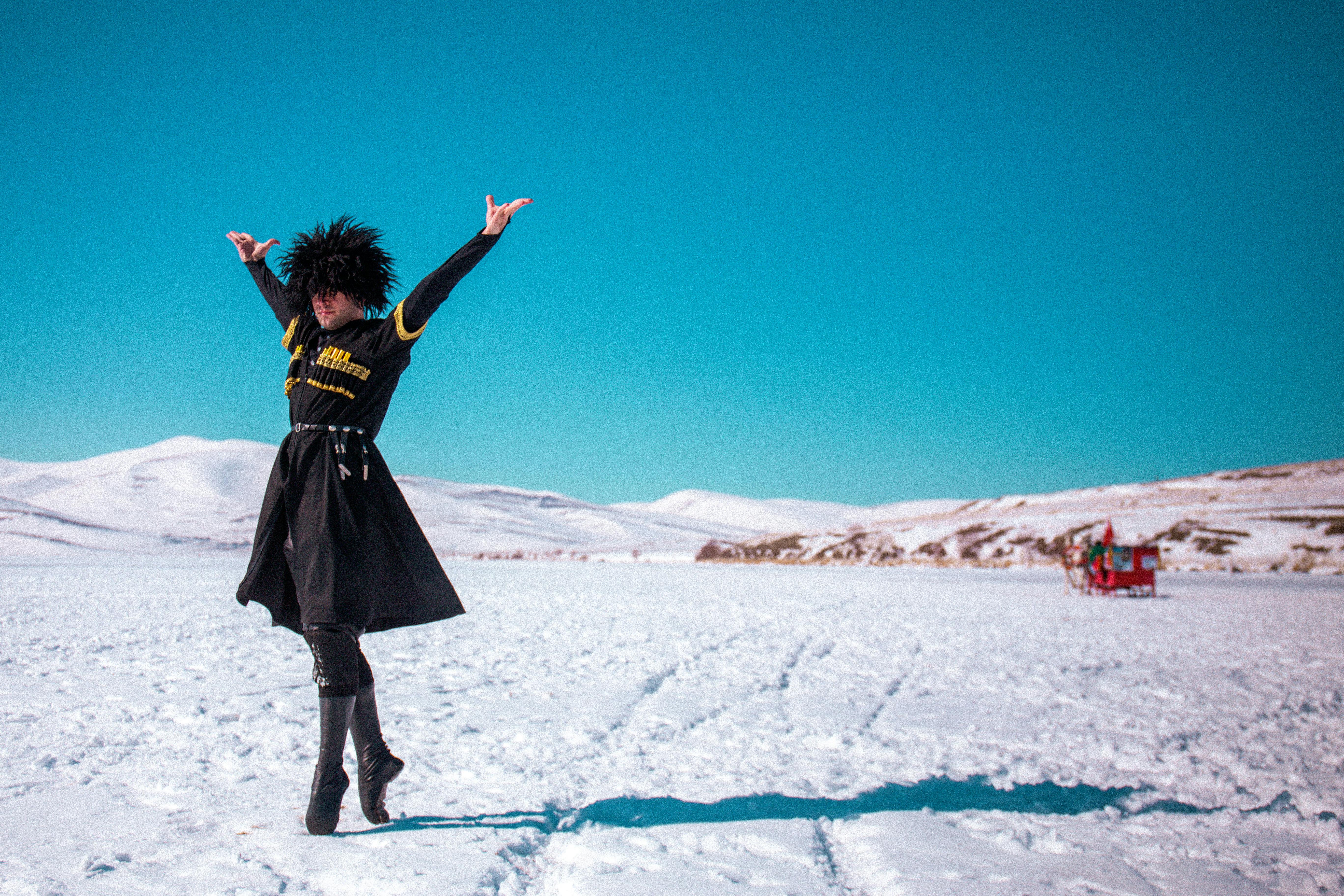 Man in Traditional Clothing Performing Traditional Dance · Free Stock Photo