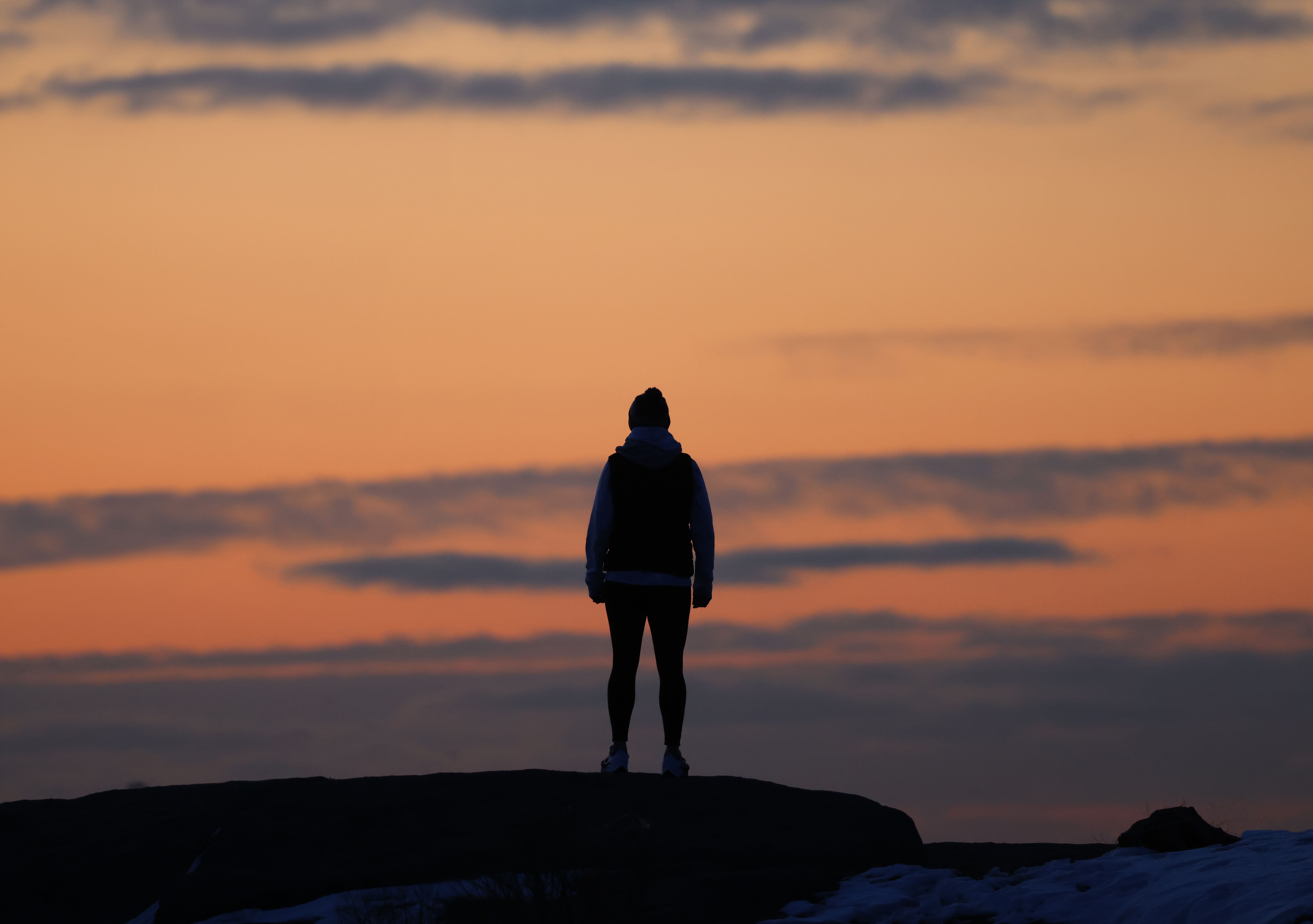 Person Standing on Hill and Looking at Sunset · Free Stock Photo