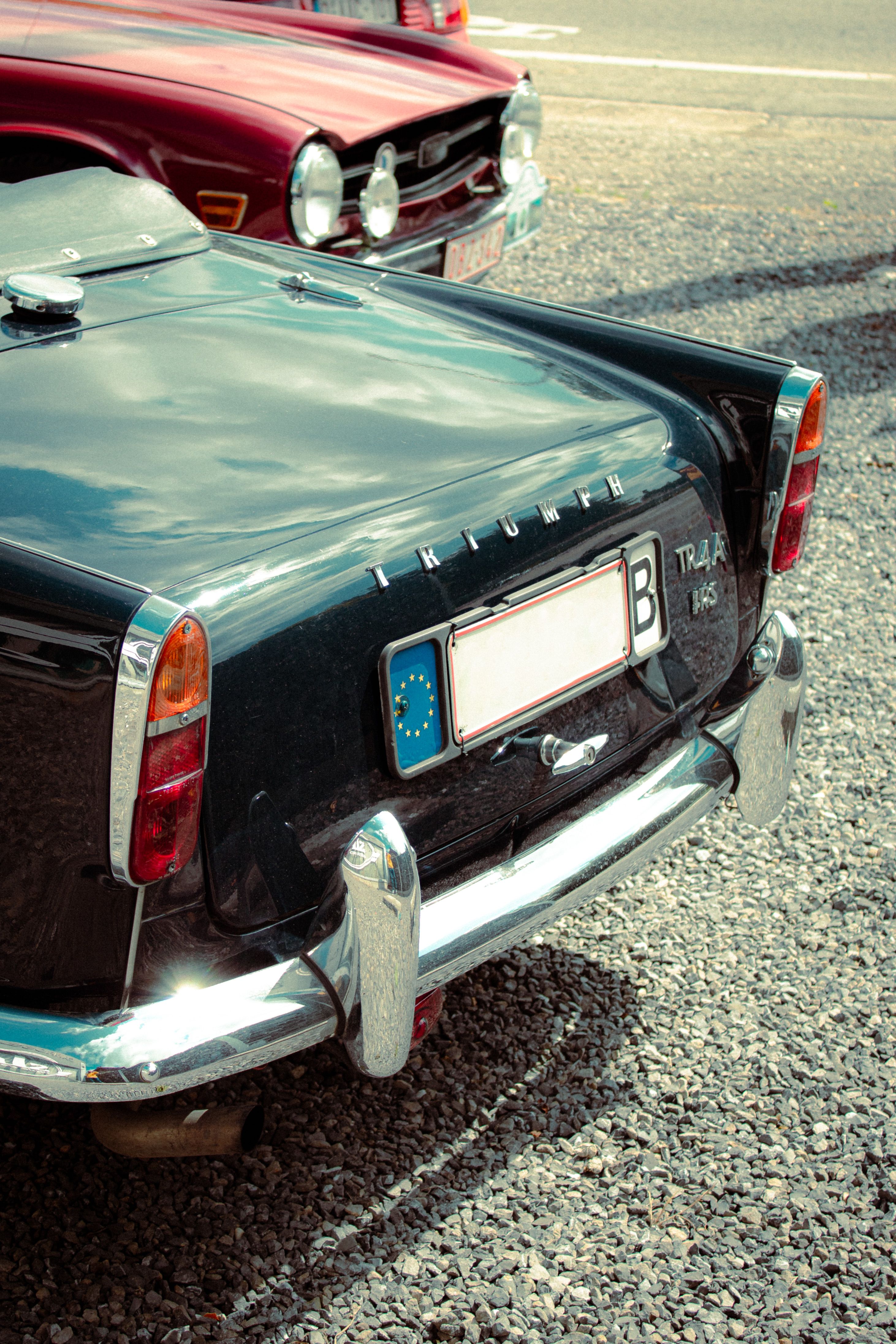Trunk of Vintage Triumph TR4A and Red Triumph TR6 · Free Stock Photo