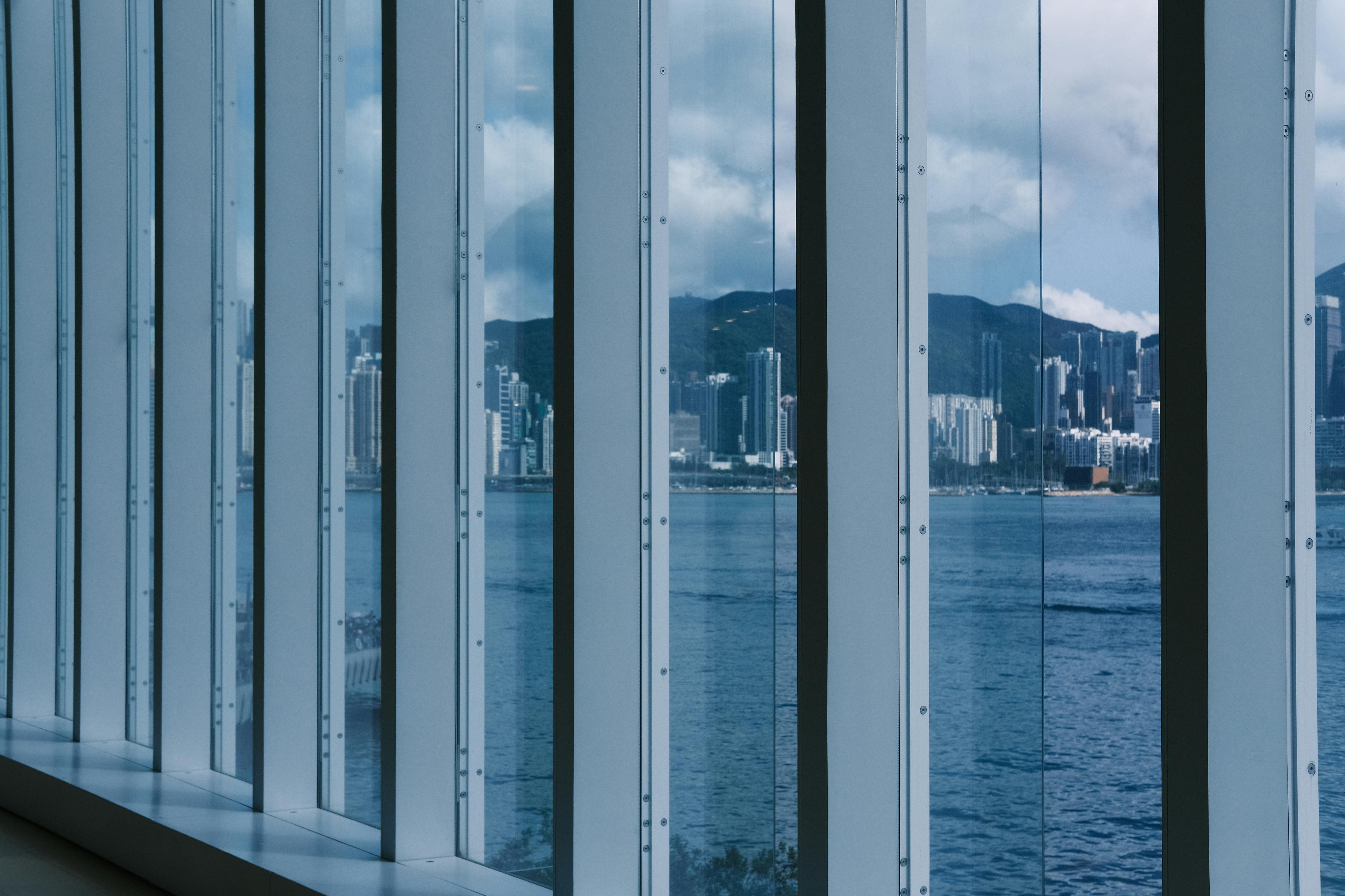 Sea and City behind Windows · Free Stock Photo