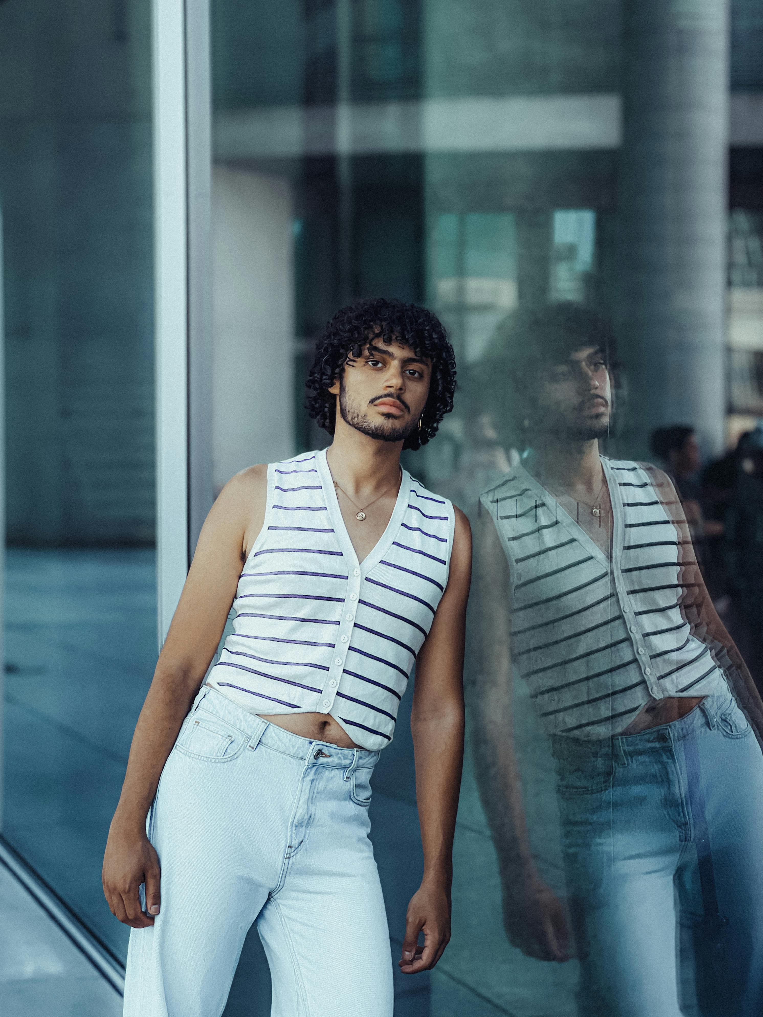 Man Leaning against Glass Window · Free Stock Photo