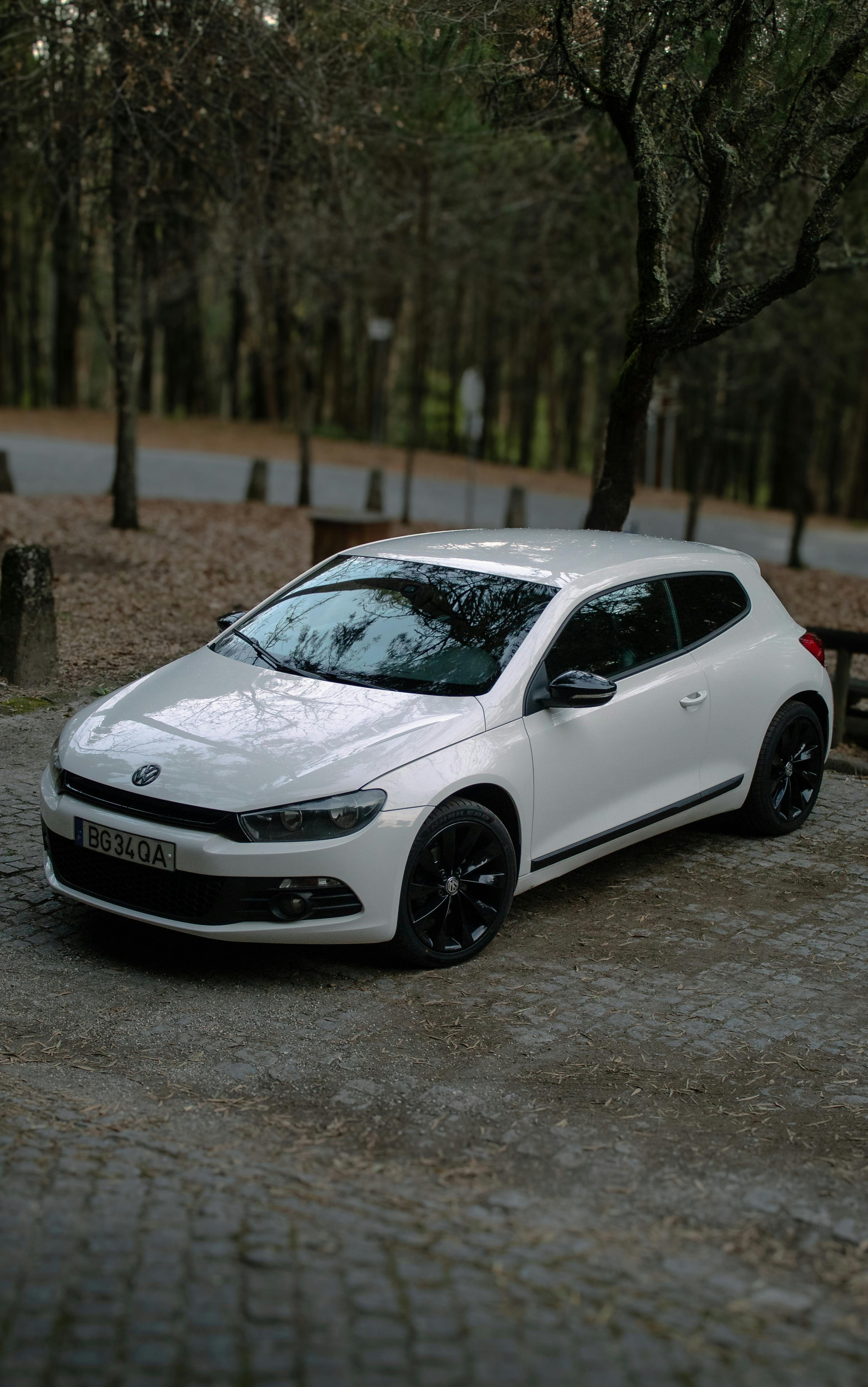 White Volkswagen Scirocco Car in a Parking Lot · Free Stock Photo