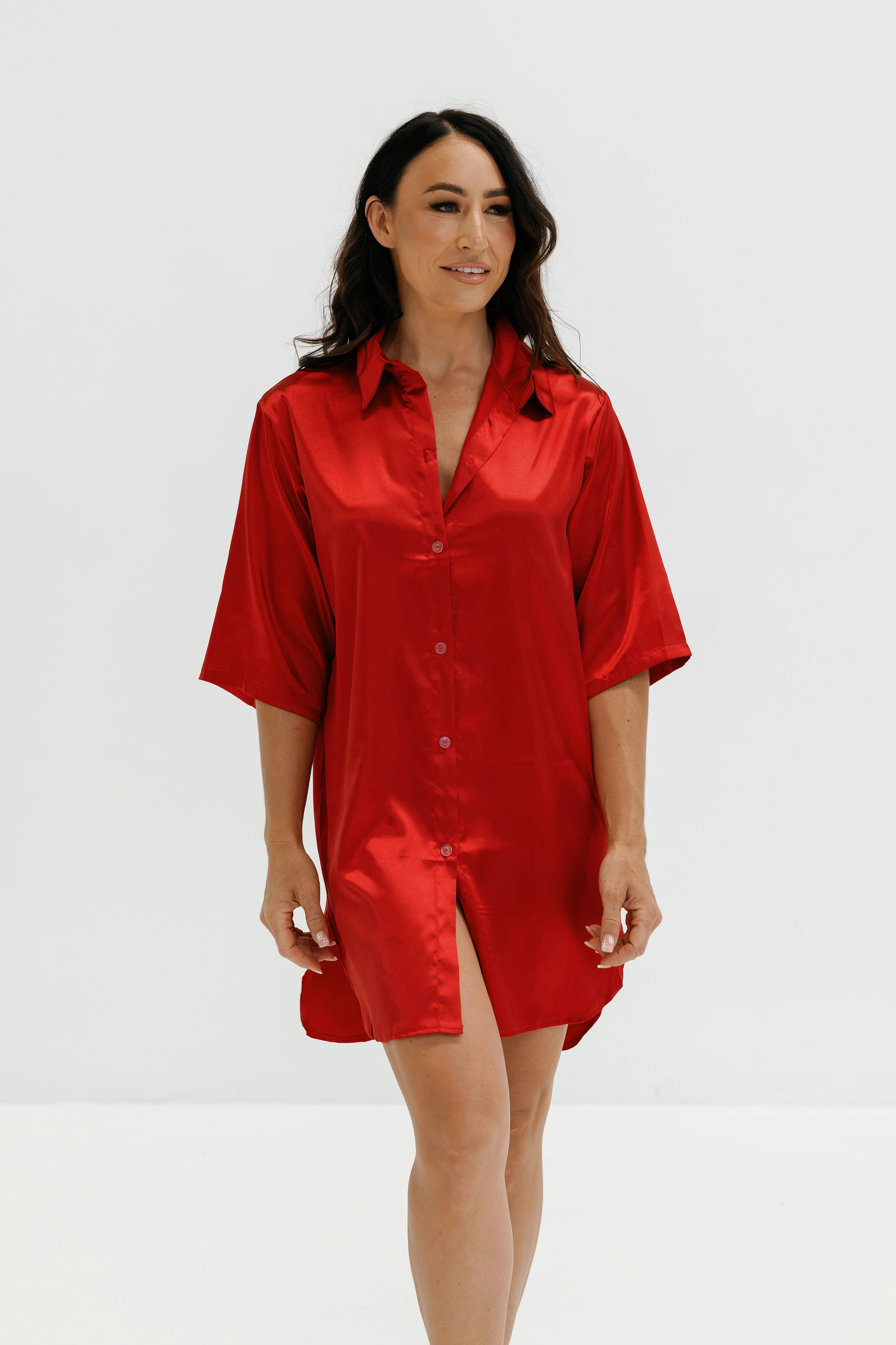 The red silk shirt dress is made from a satin material · Free Stock Photo
