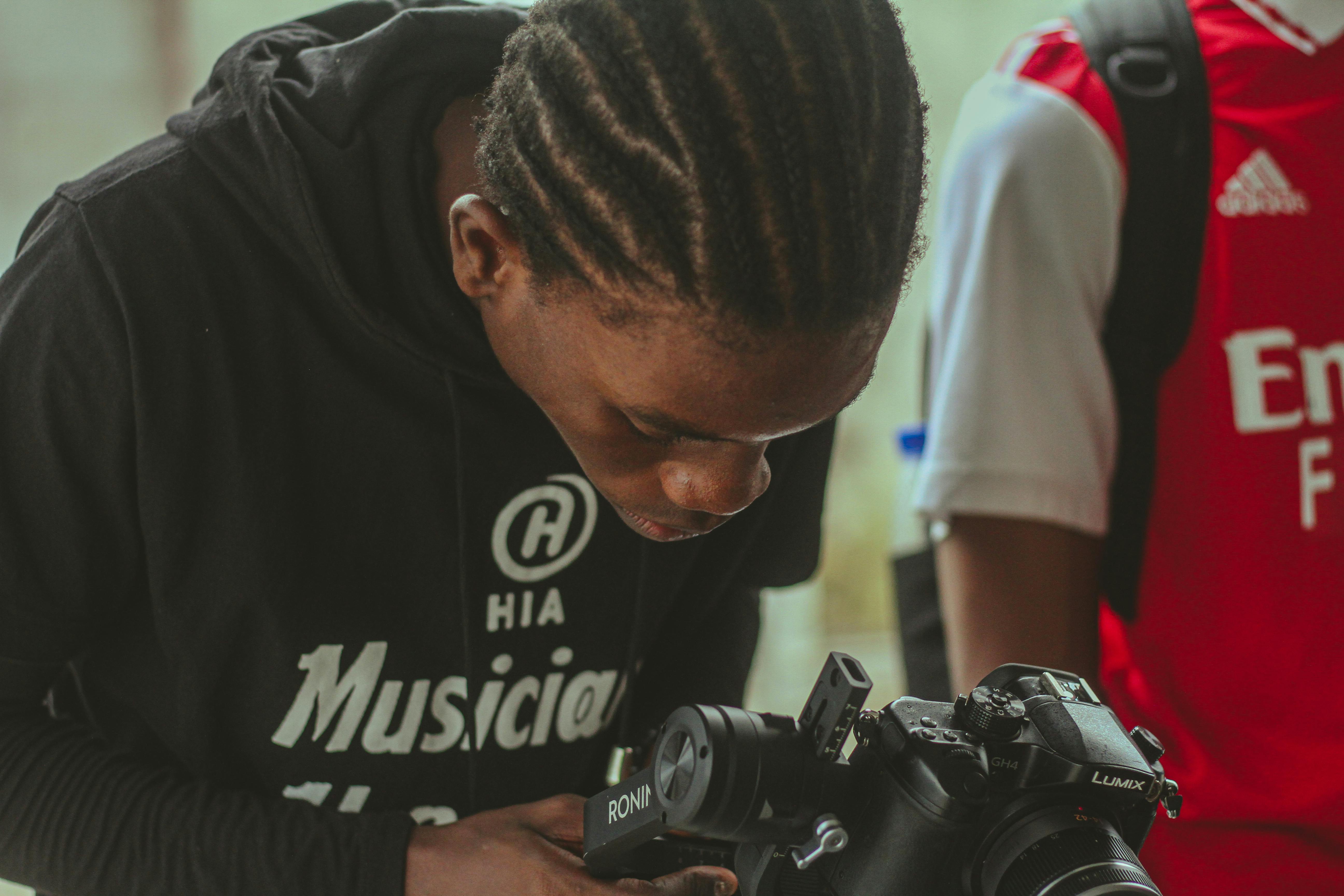 Cameraman Holding Camera · Free Stock Photo