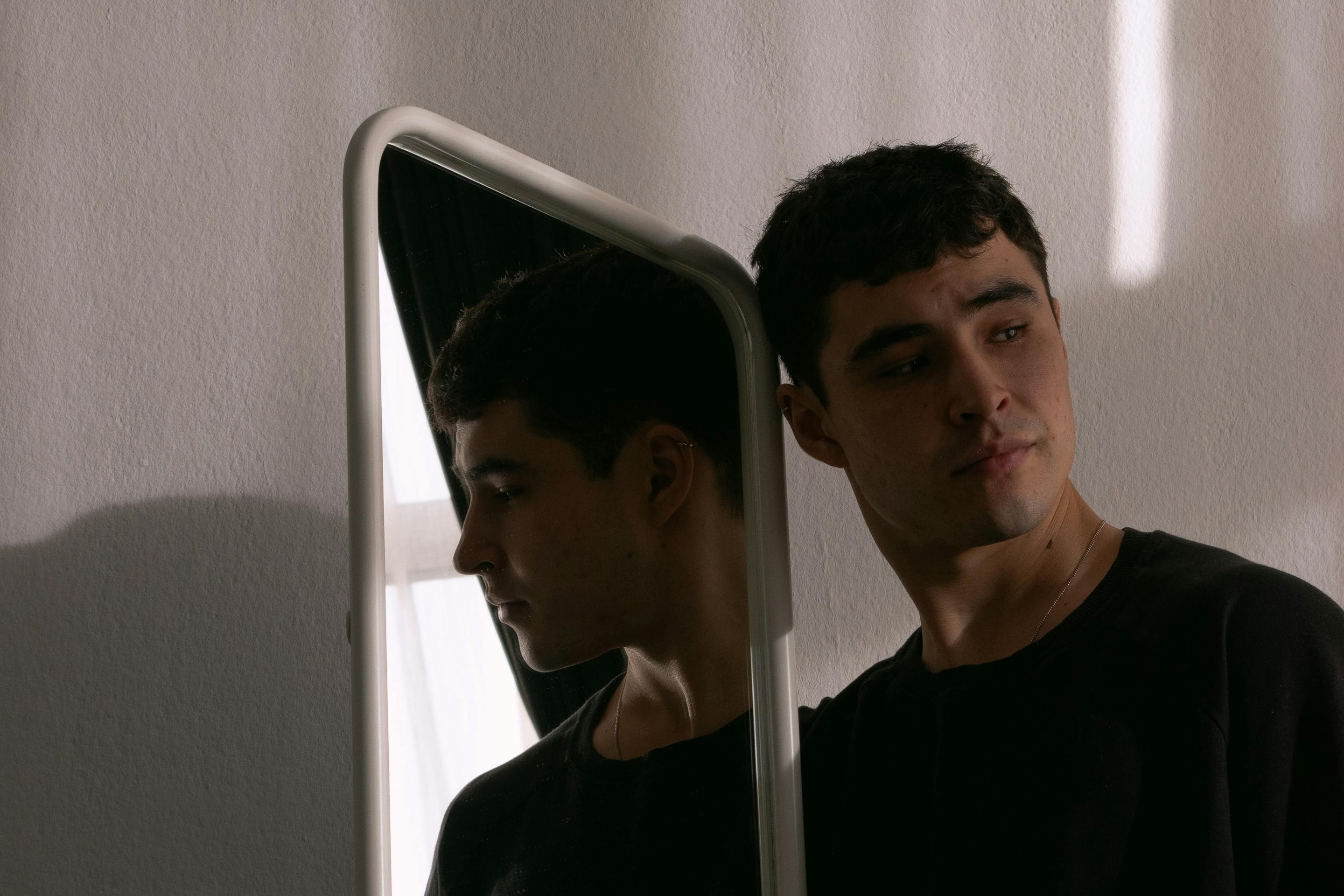 Monochrome Photography of a Man Looking In front of Mirror · Free Stock ...