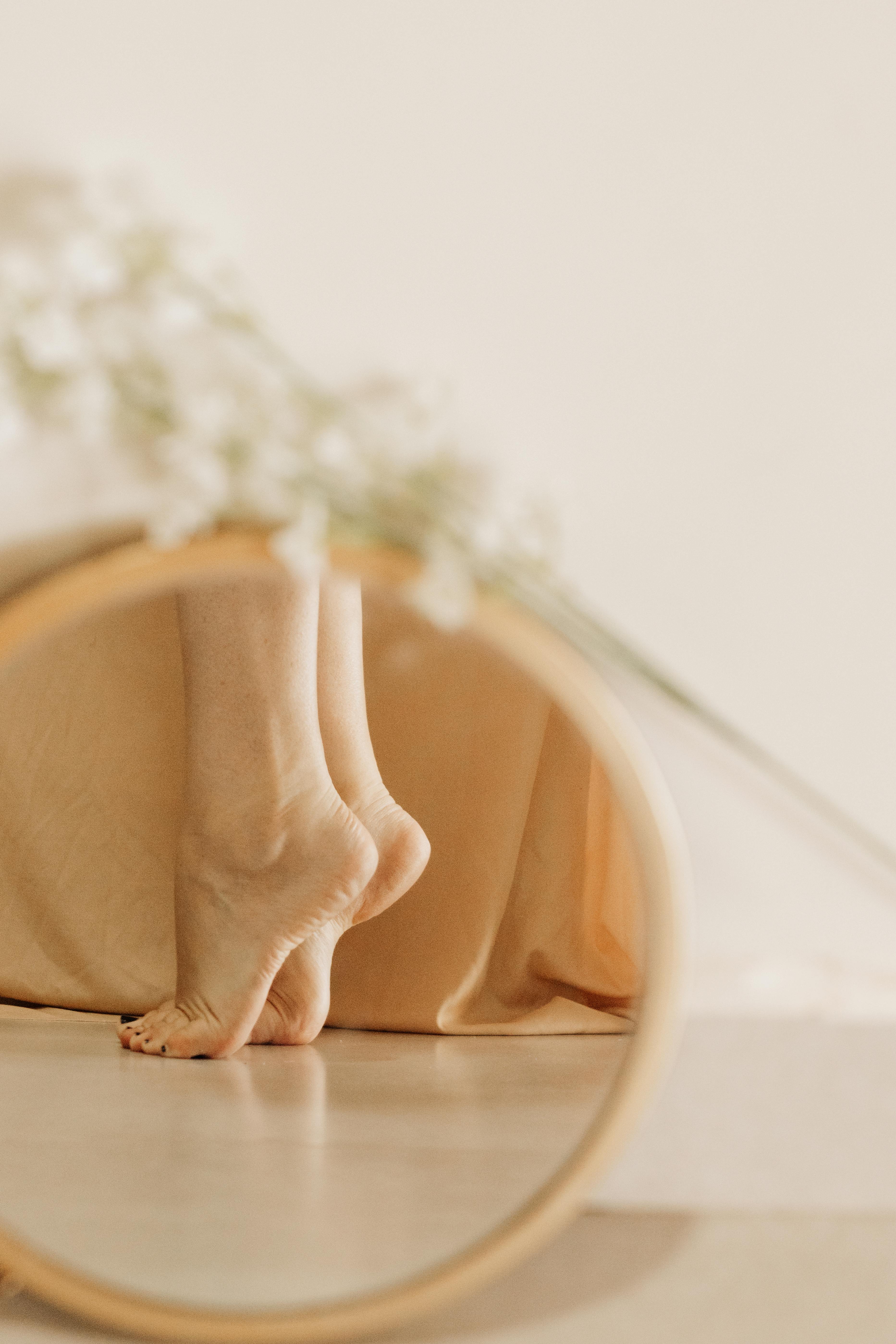 Woman Feet Reflection in Mirror · Free Stock Photo