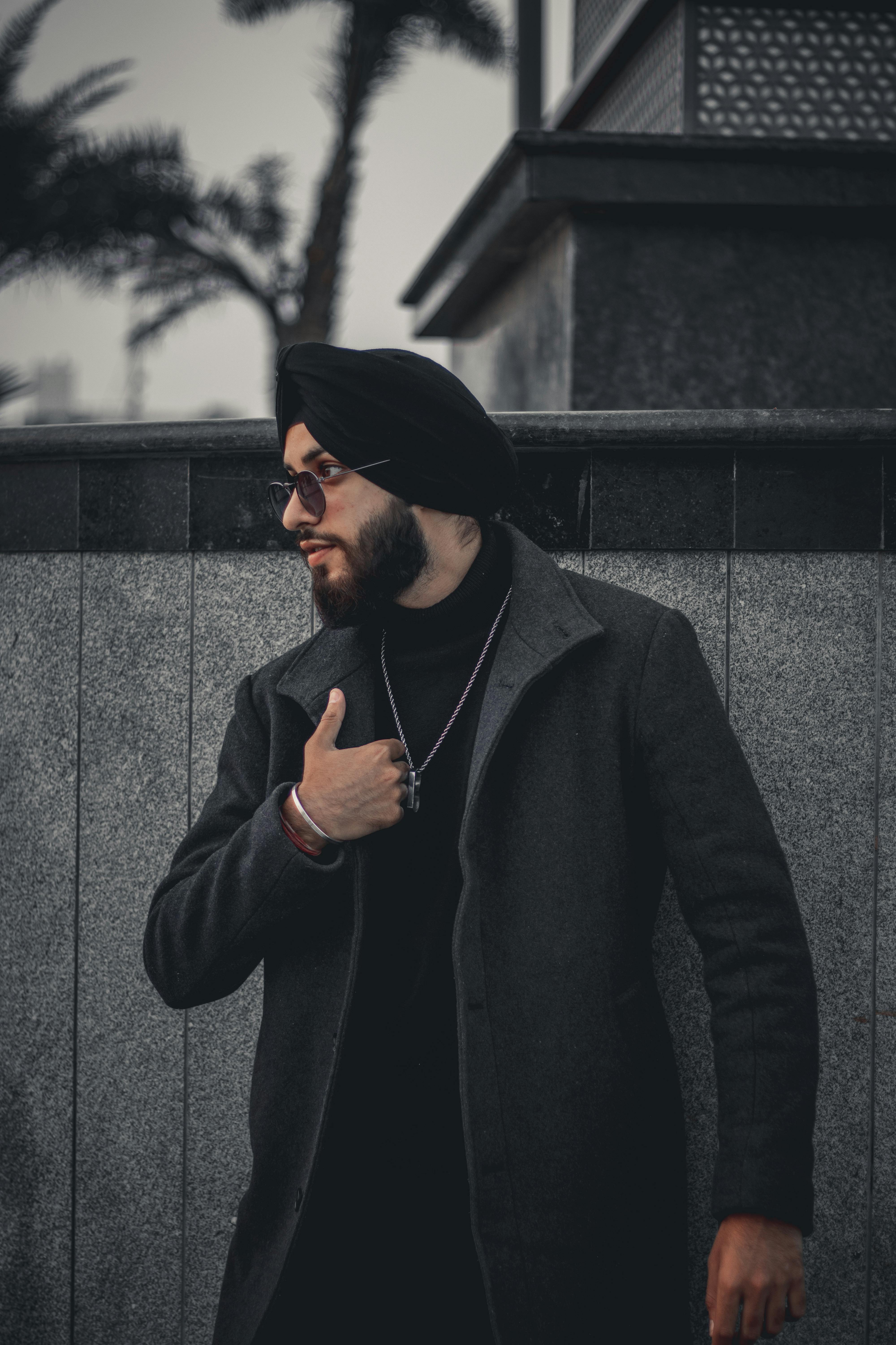 Model in a Black Turban and Coat · Free Stock Photo
