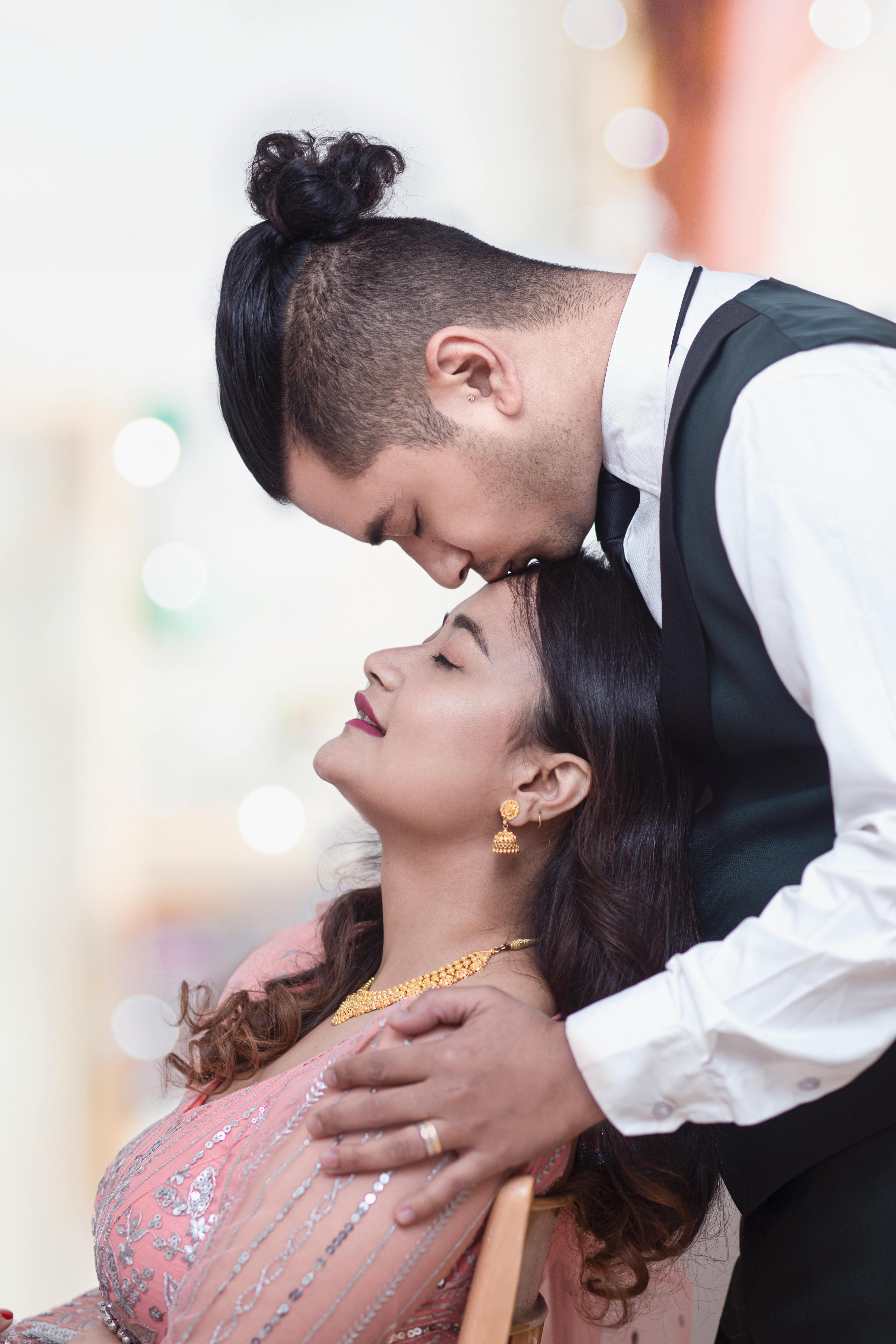 Man in Shirt and Vest Standing over Woman and Kissing · Free Stock Photo