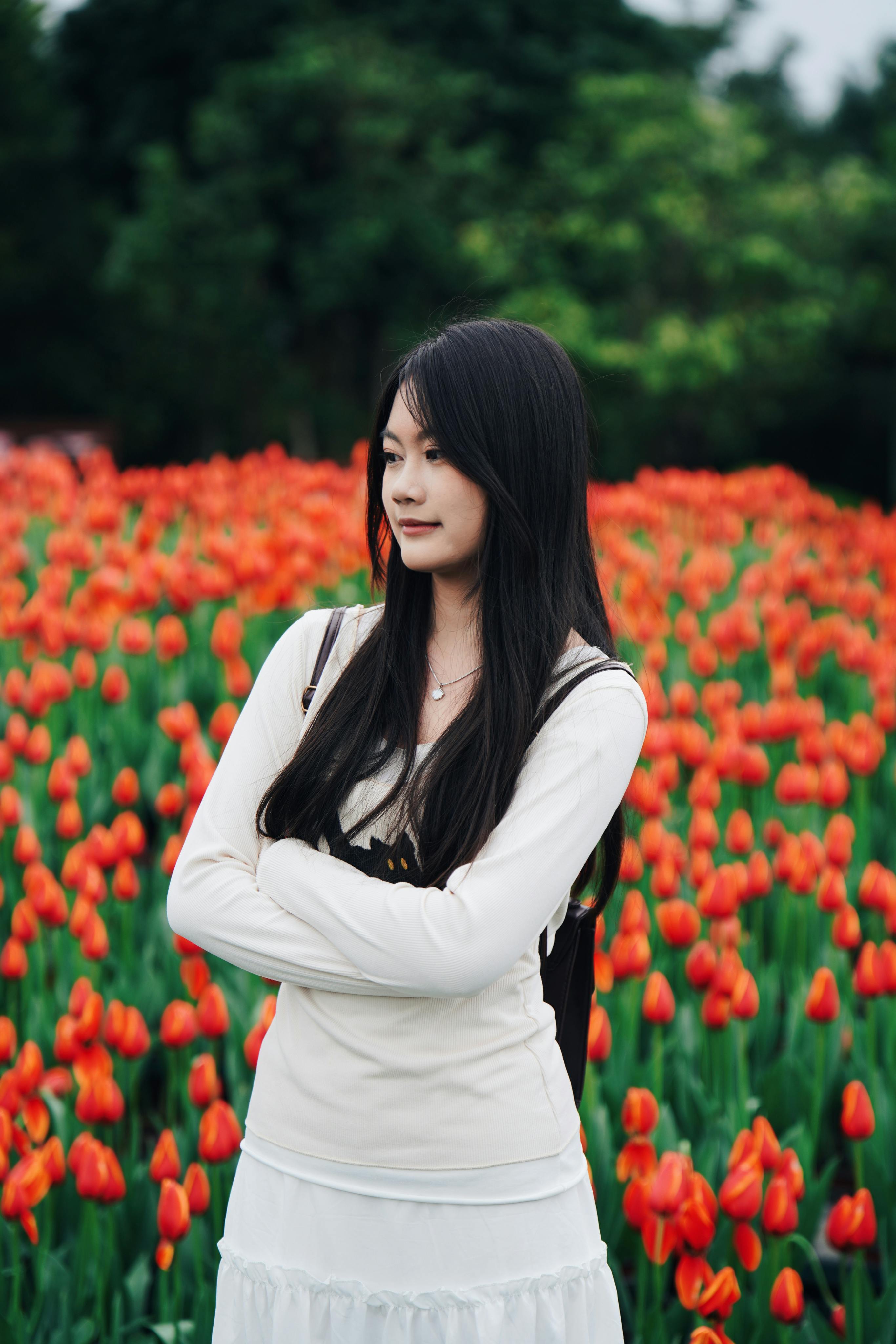 Portrait of Woman in Tulips Field · Free Stock Photo