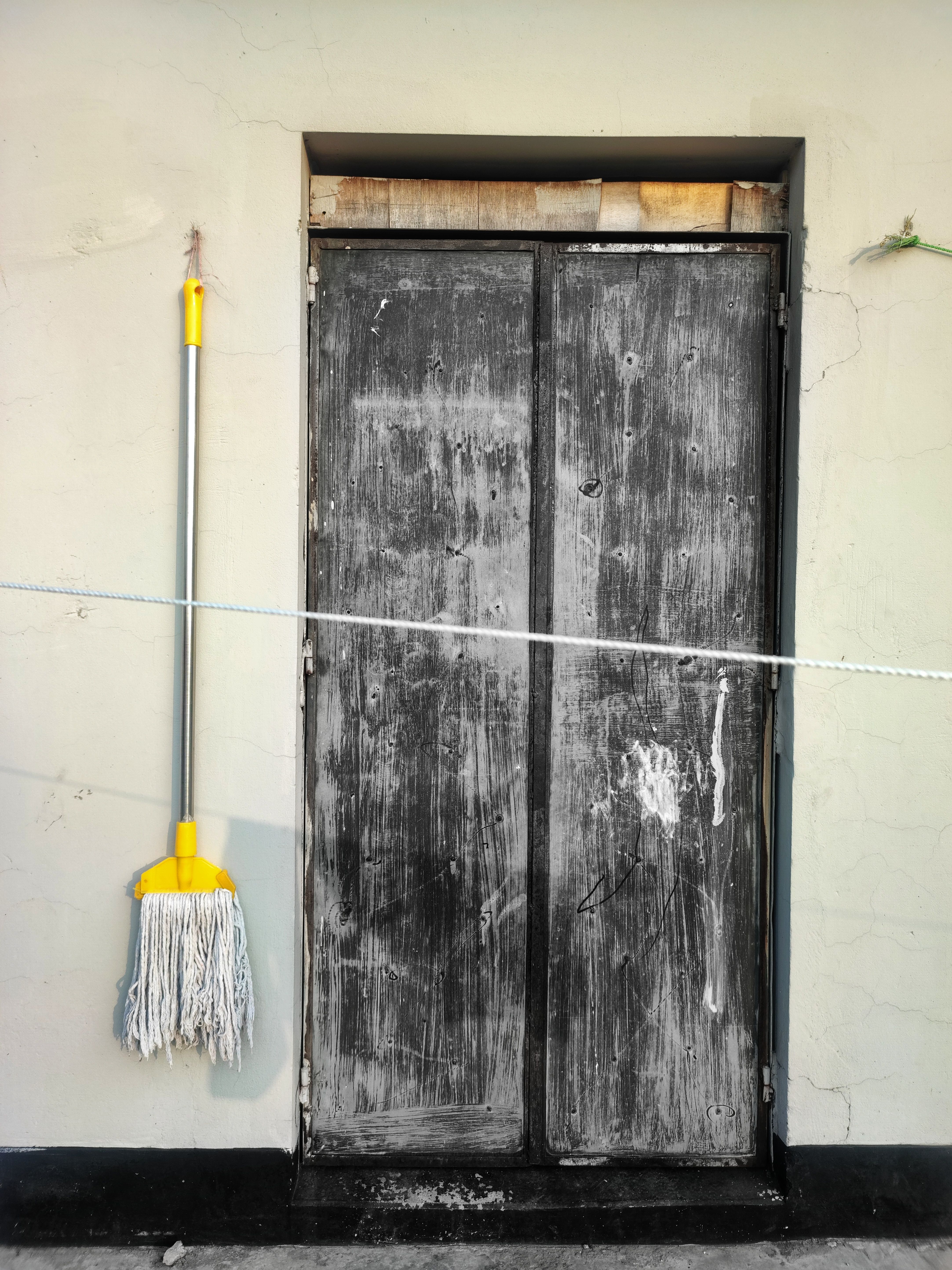 Floor Mop by Wooden Door · Free Stock Photo